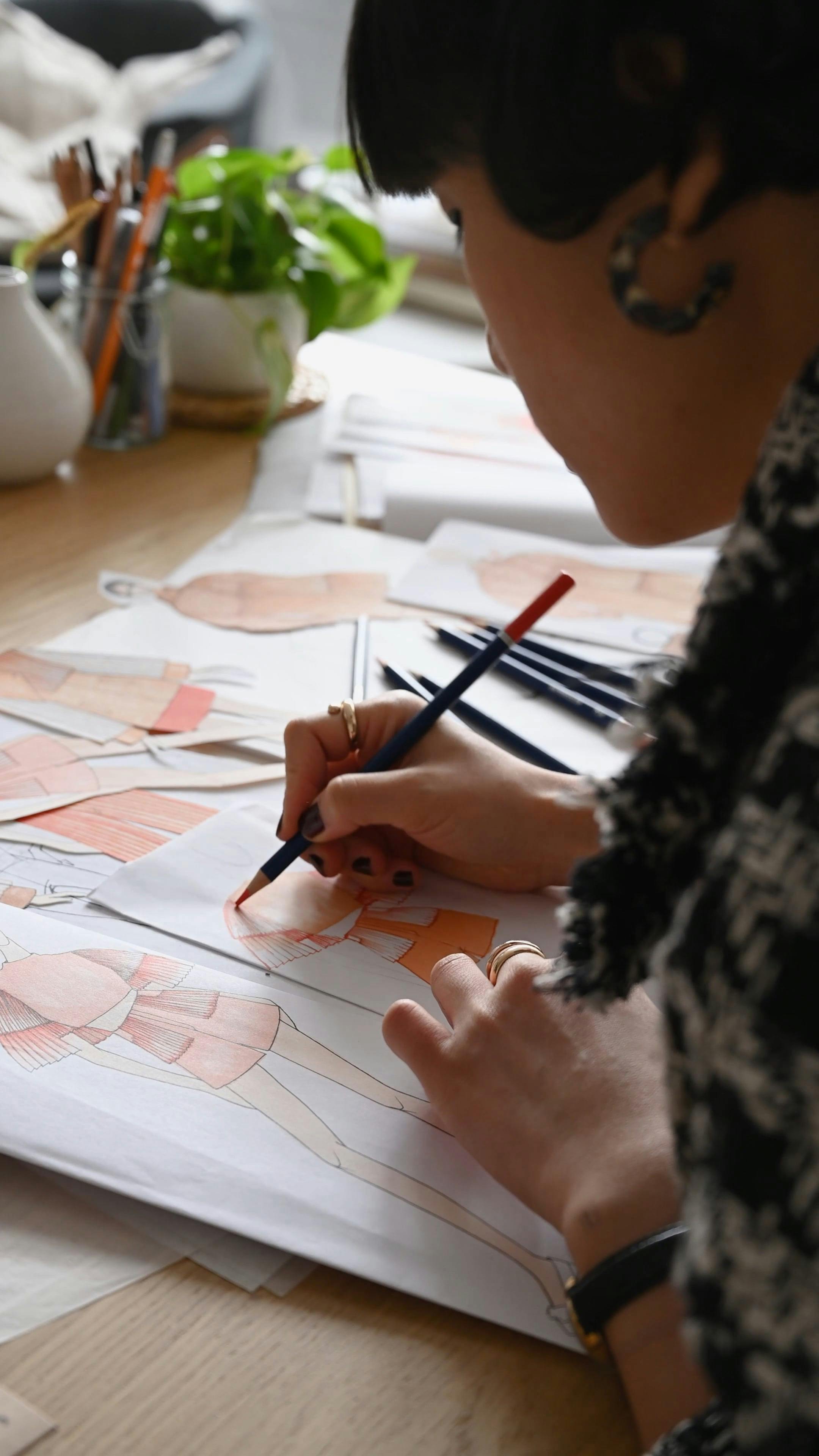 Man Drawing on a Piece of Paper · Free Stock Video