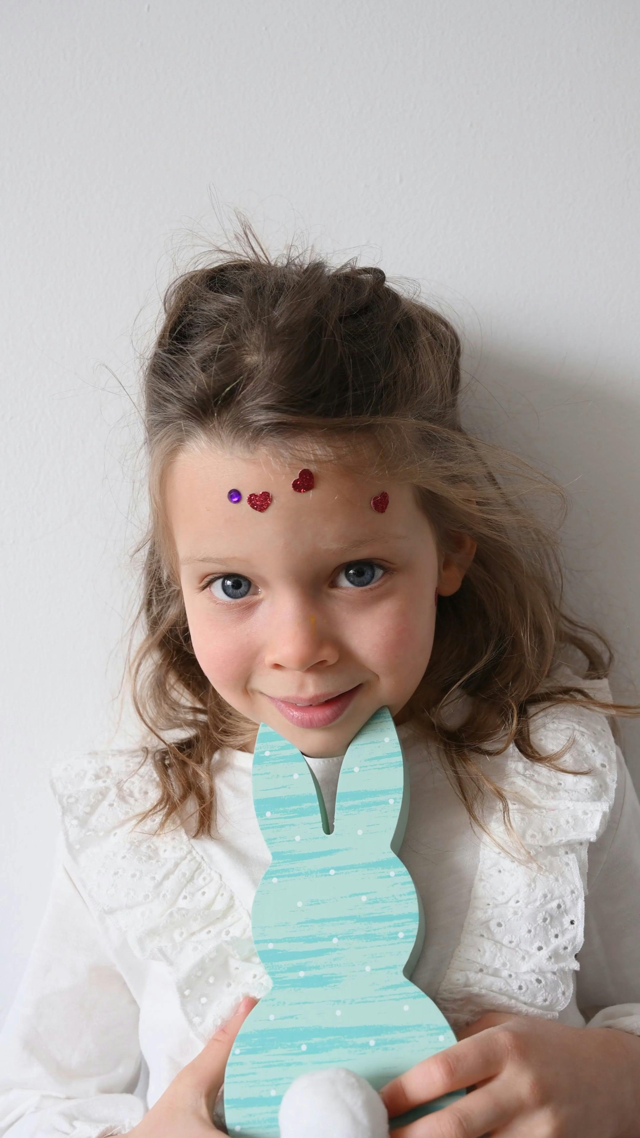 Cute Little Girl with Stickers on Her Face · Free Stock Video