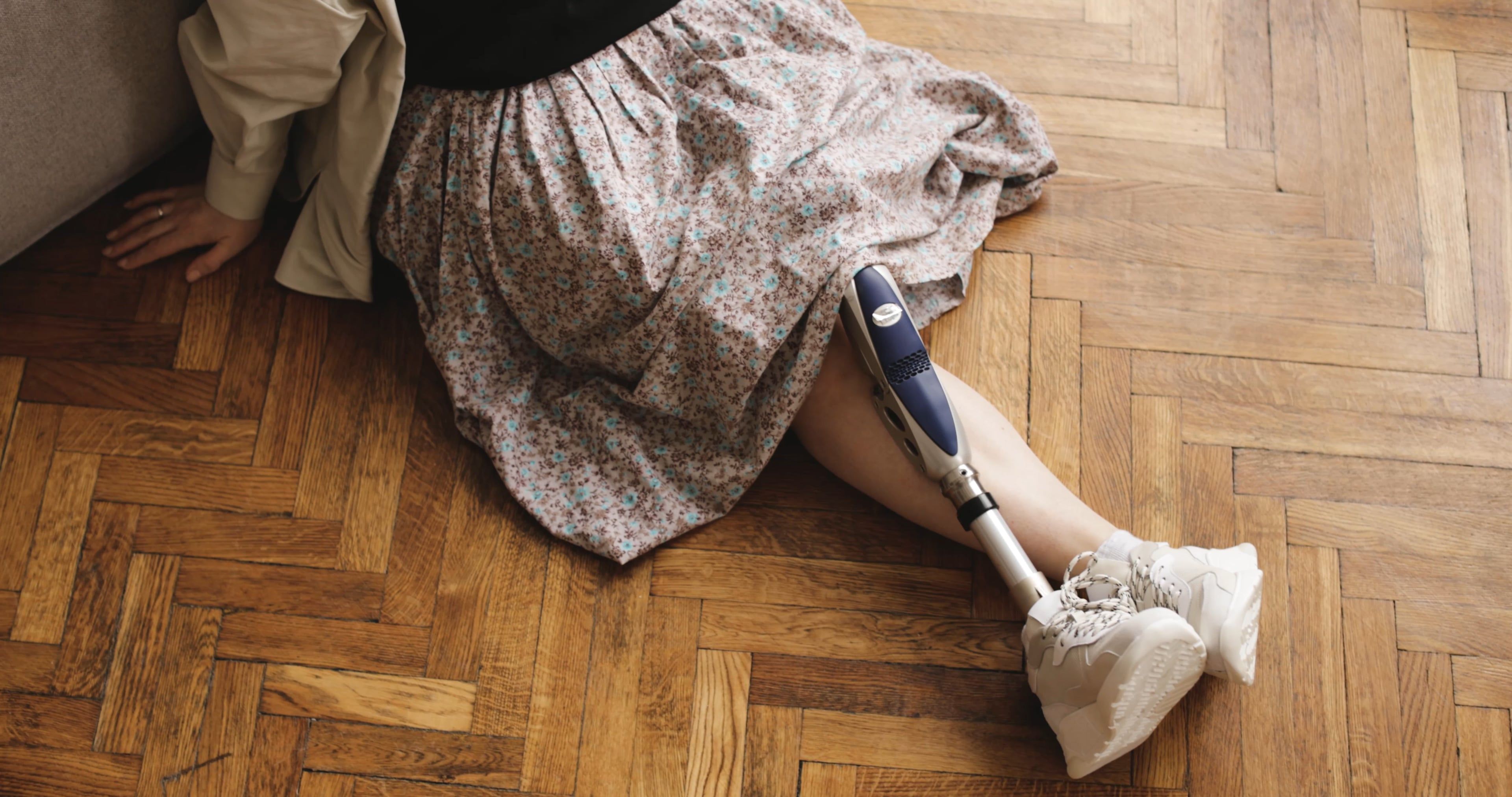 Woman with a Prosthetic Leg Sitting on the Floor Free Stock Video ...