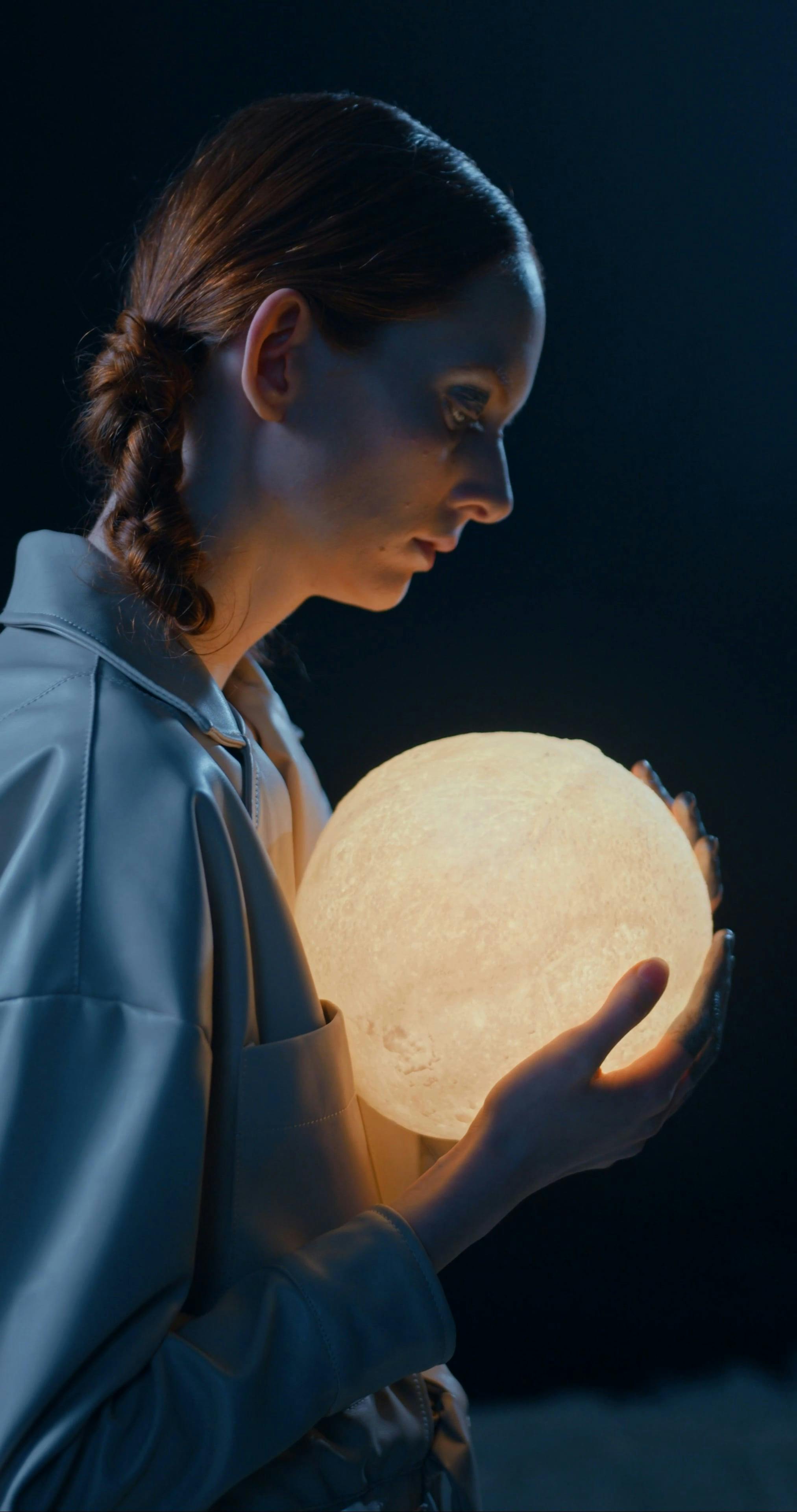 A Woman Holding A Glowing Sphere · Free Stock Video