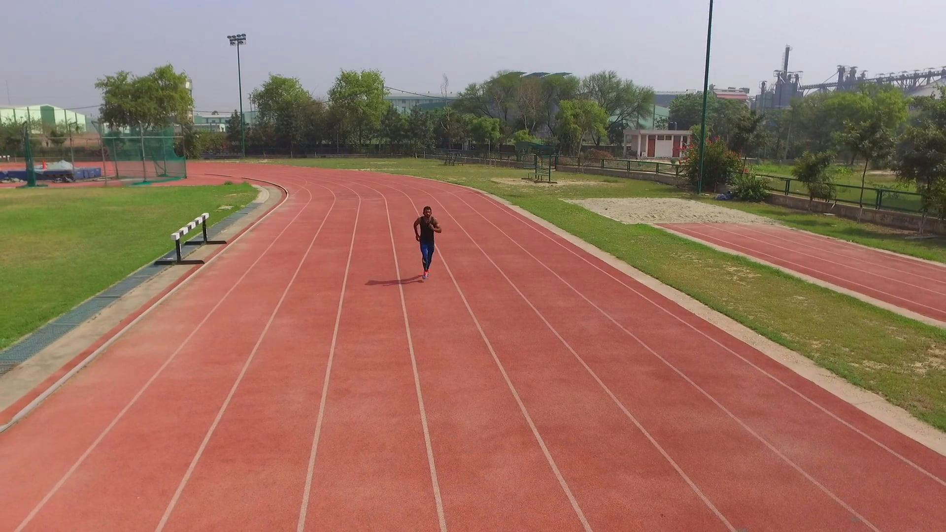 Aerial Shot of a Man Running on the Track Free Stock Video Footage ...