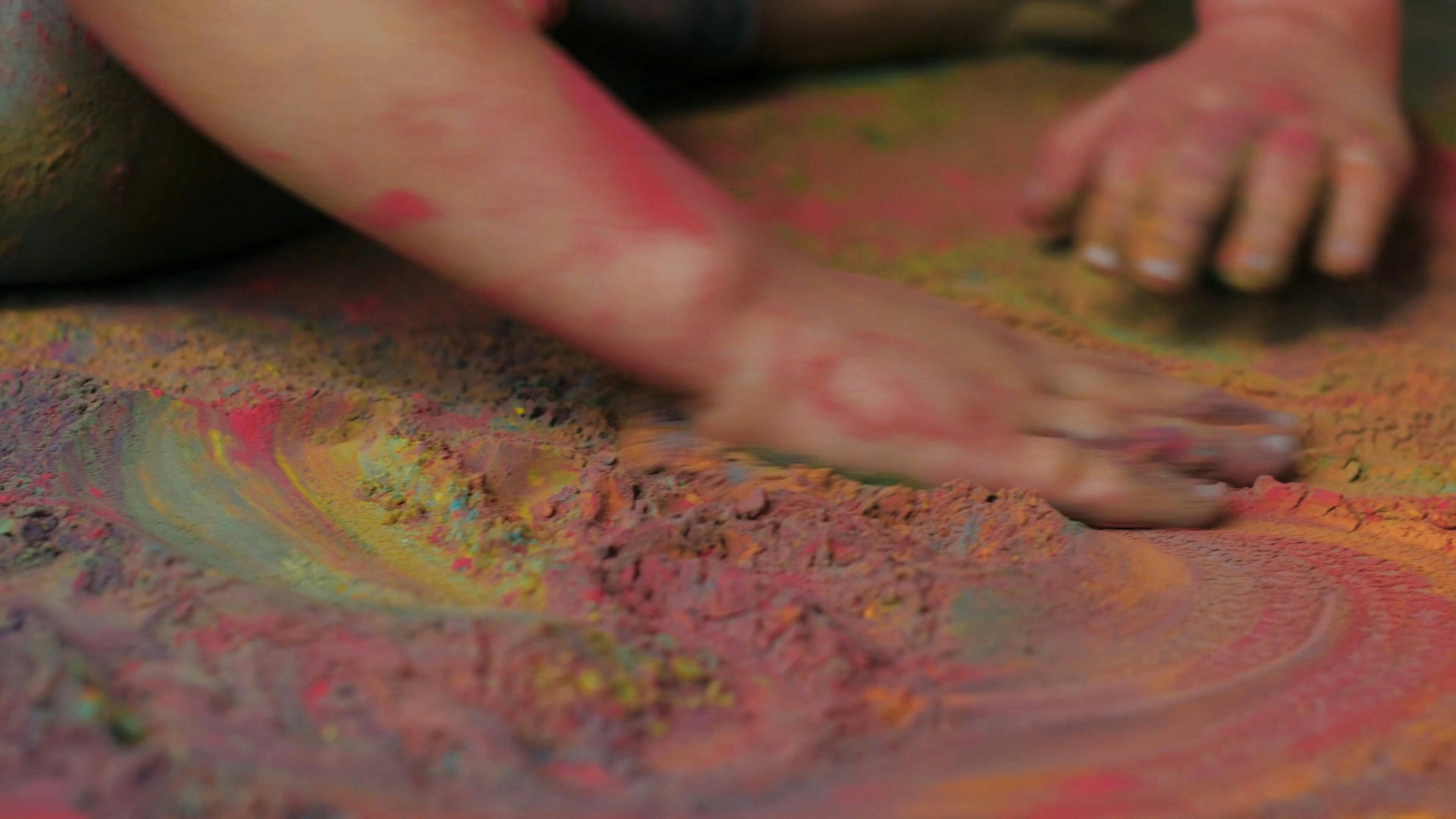 A Person Mixing Different Colors of Powder on the Ground Free Stock ...