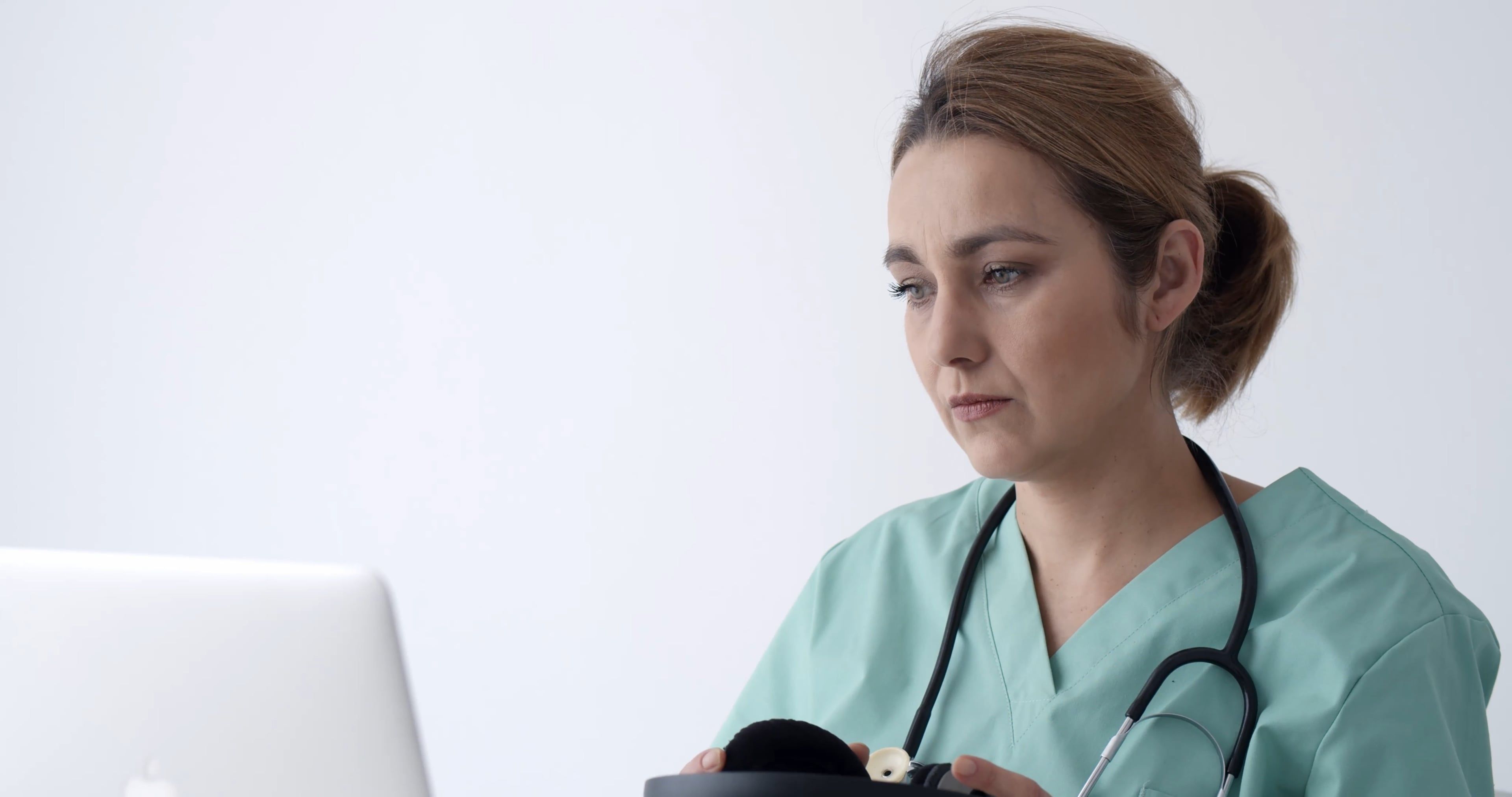 A Female Doctor Wearing A Headset · Free Stock Video