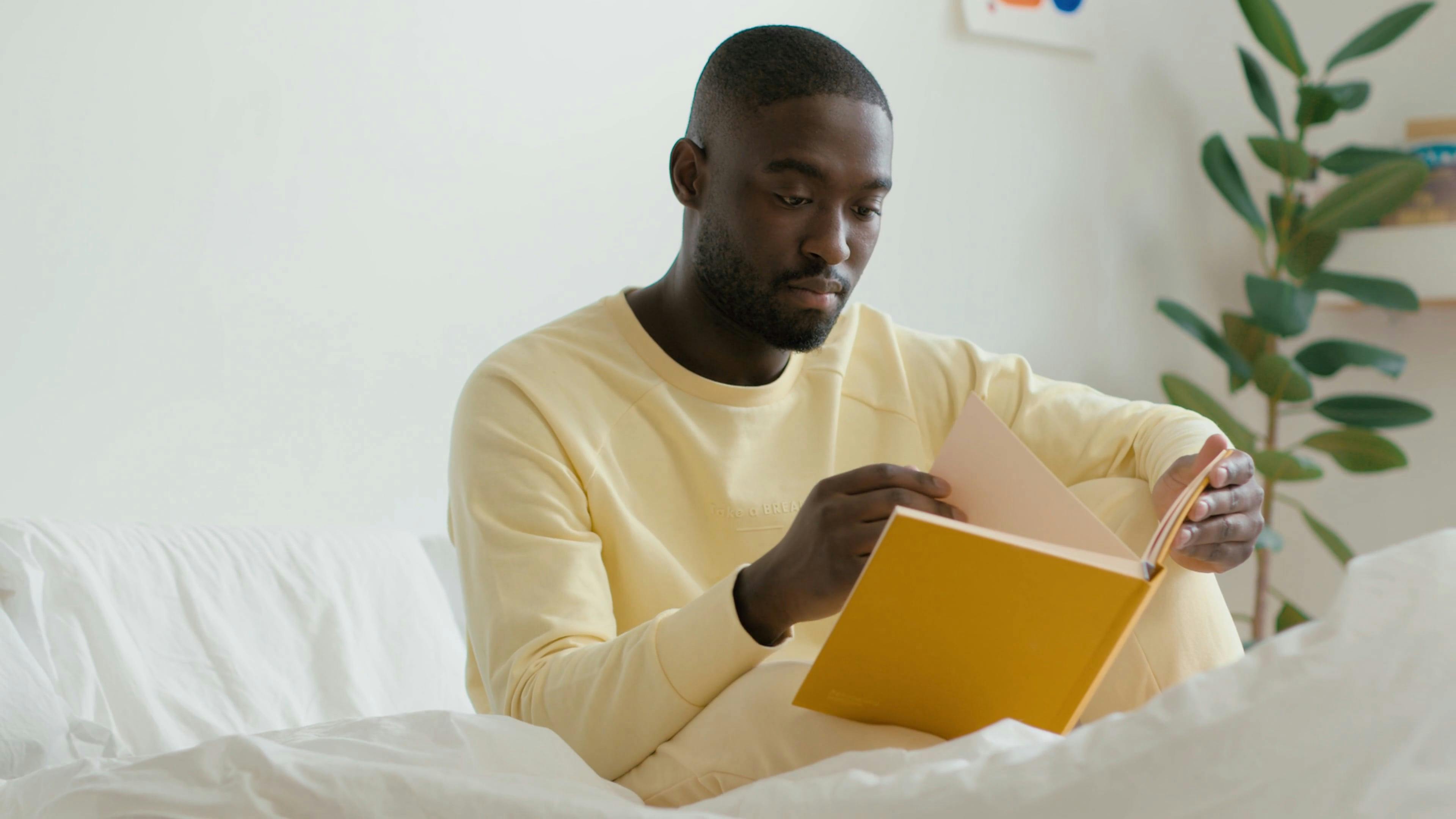Man Enjoying Reading a Book Free Stock Video Footage, Royalty-Free 4K ...