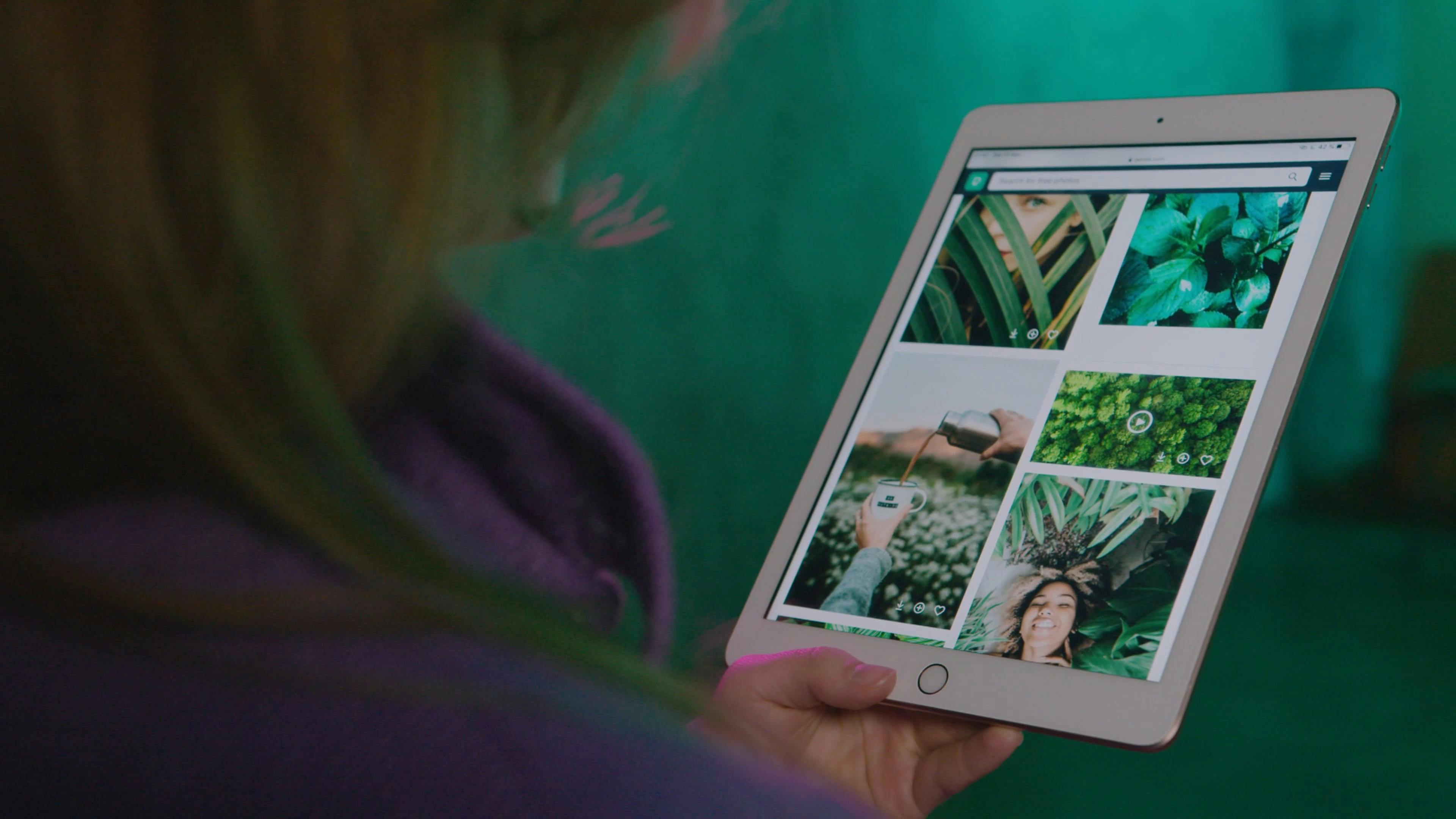 Close-up Footage of a Person Browsing the Internet Using a Tablet Free ...