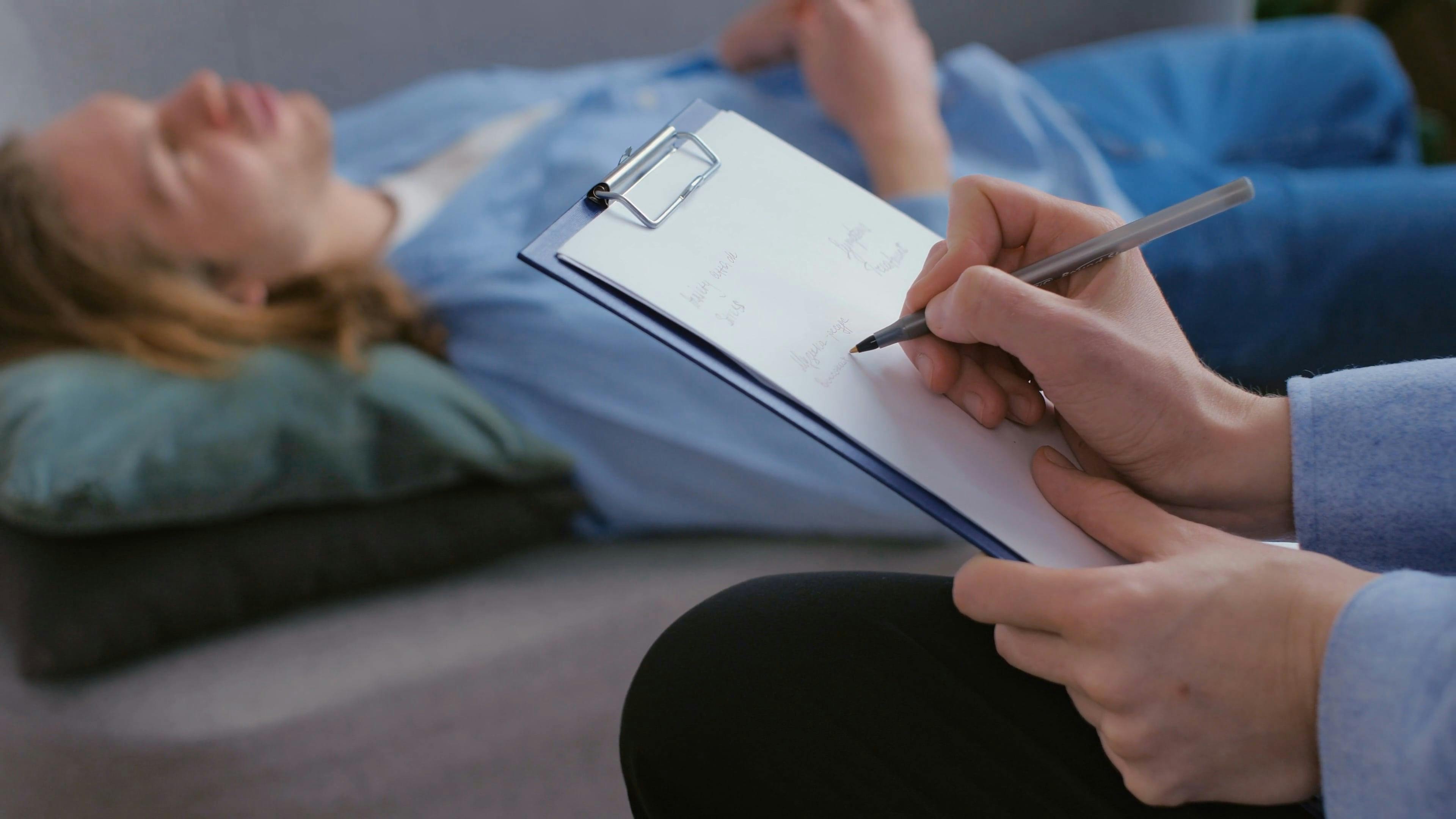 A Therapist Taking Notes During a Therapy Session Free Stock Video ...