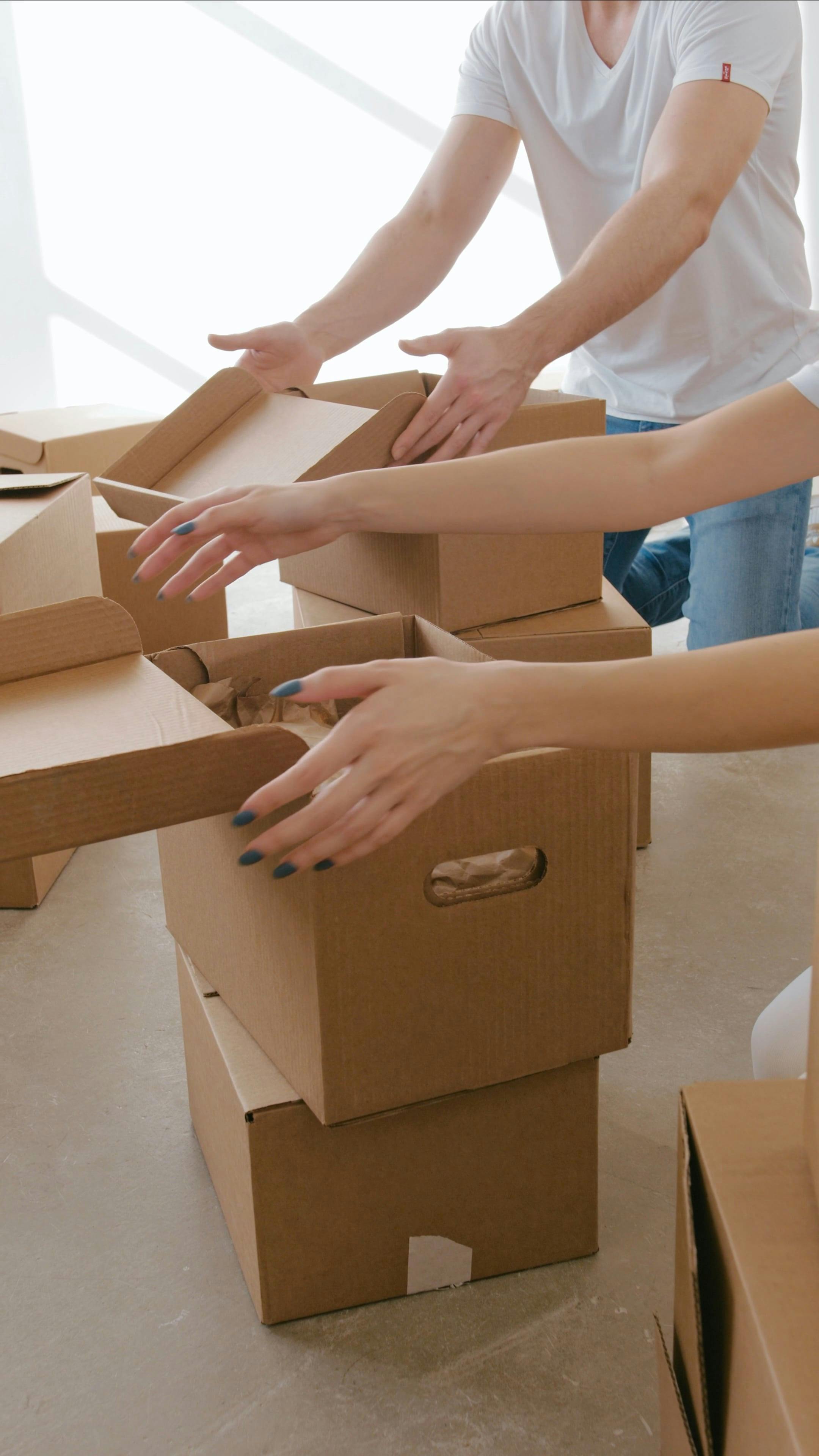 Man Pushing Boxes with Printed Messages · Free Stock Video