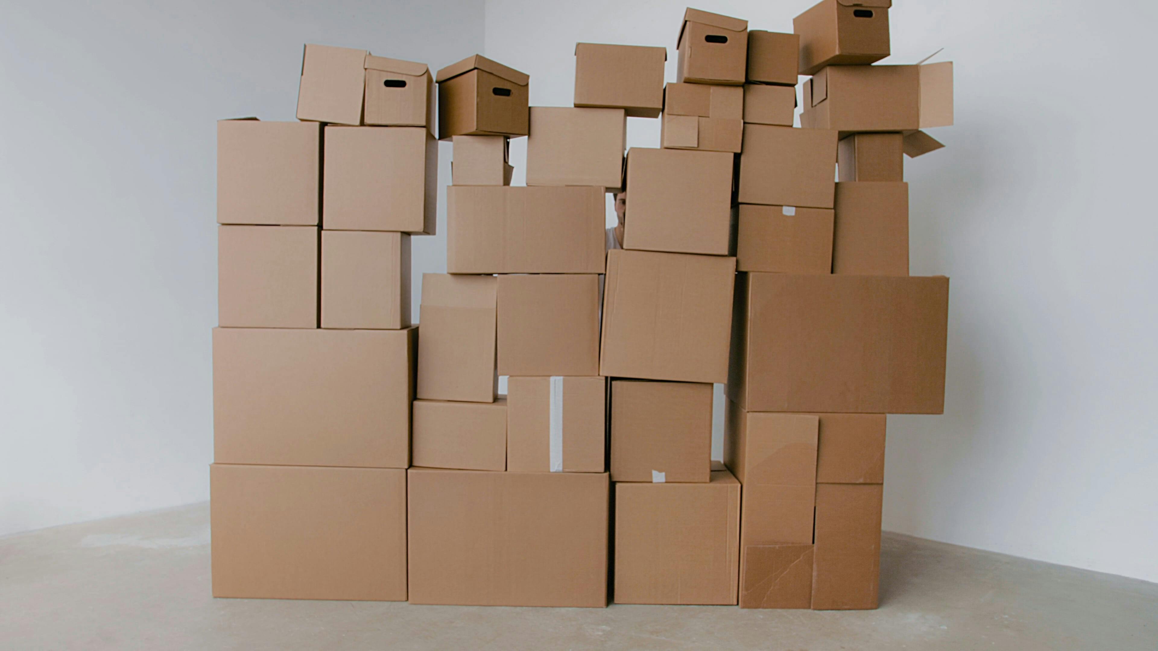 A Man Pushing a Wall of Boxes Free Stock Video Footage, Royalty-Free 4K ...