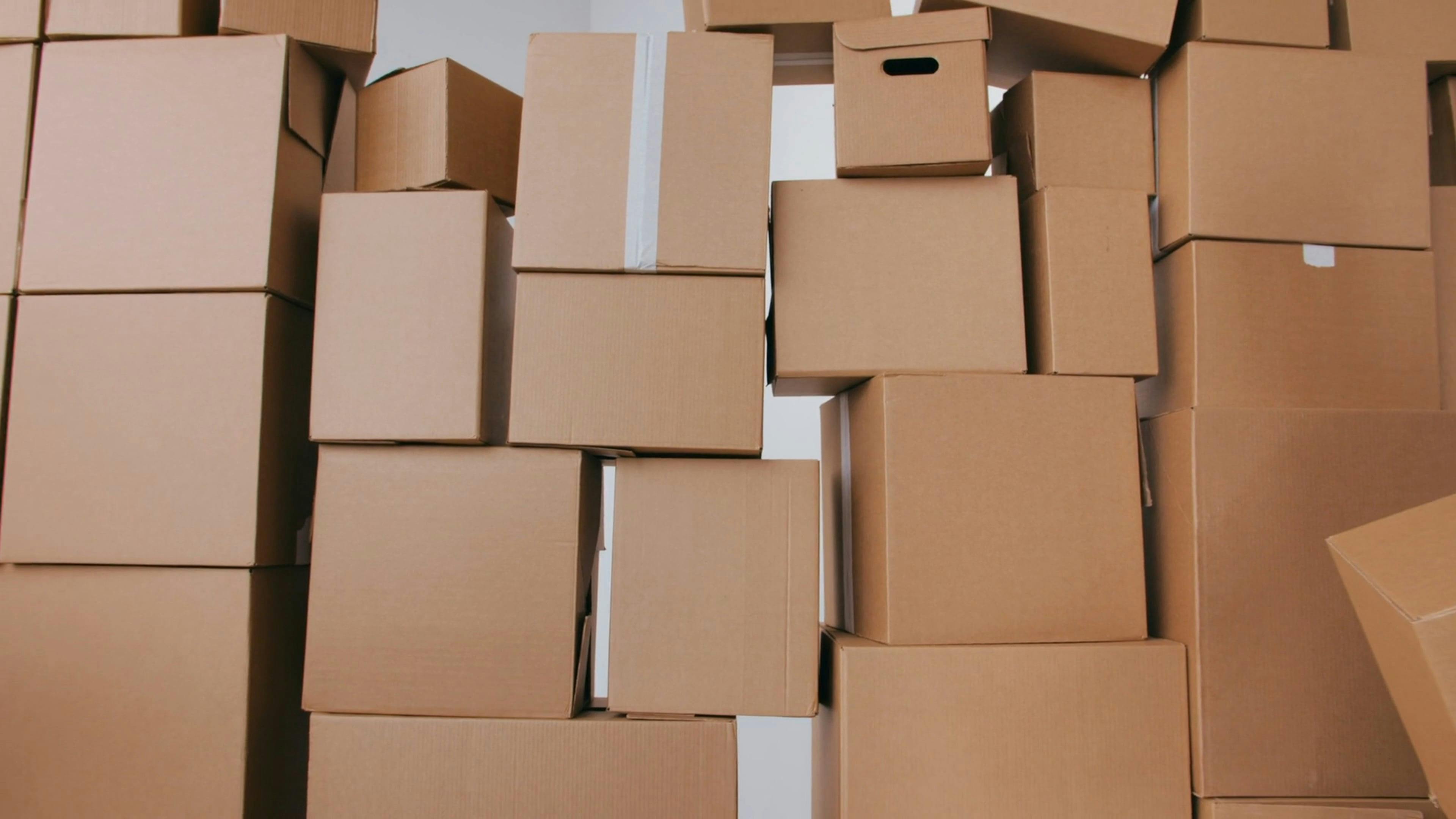 Man and Woman Piling Up the Boxes Free Stock Video Footage, Royalty ...