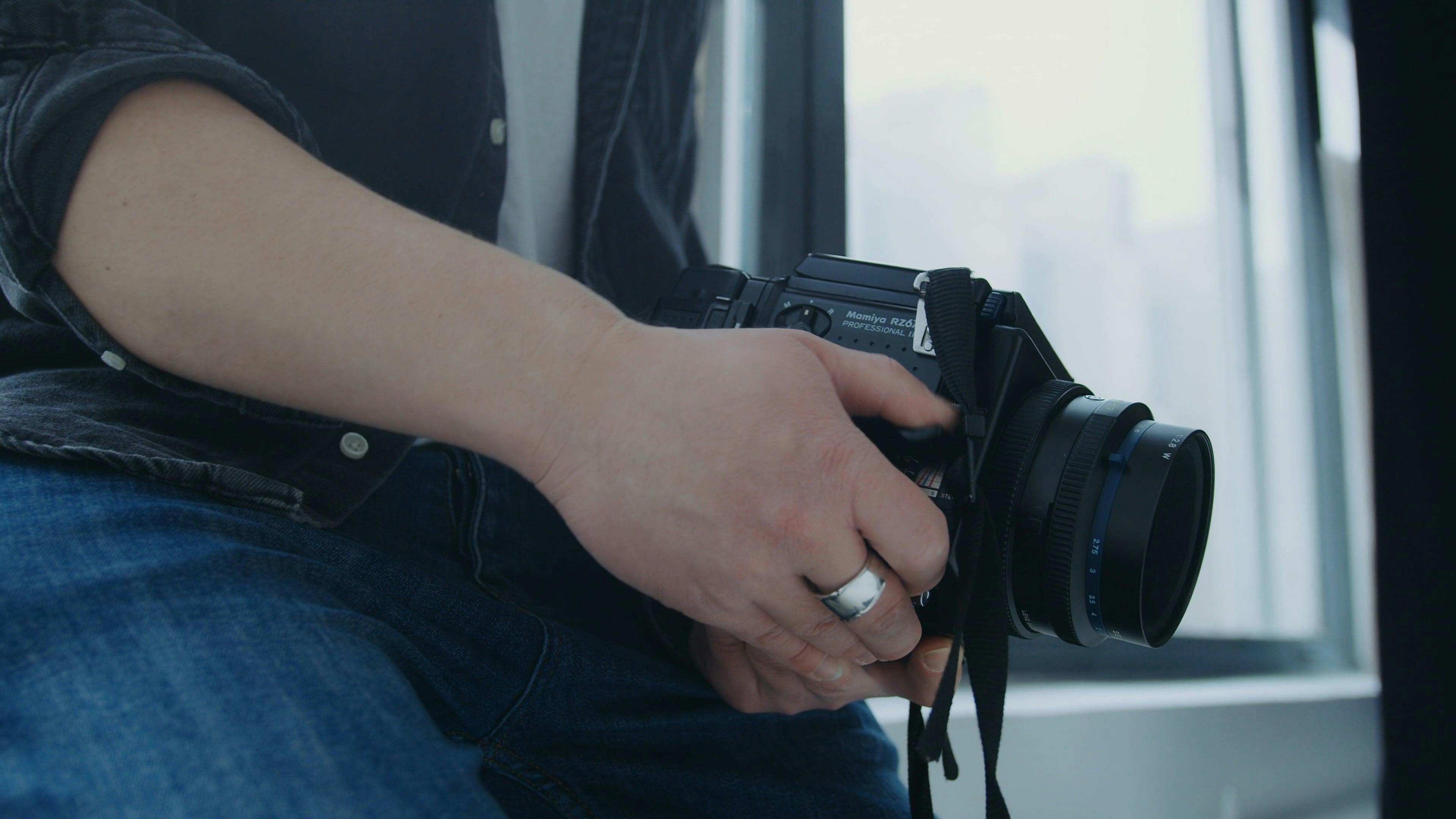 A Man Holding a Film Camera Free Stock Video Footage, Royalty-Free 4K ...