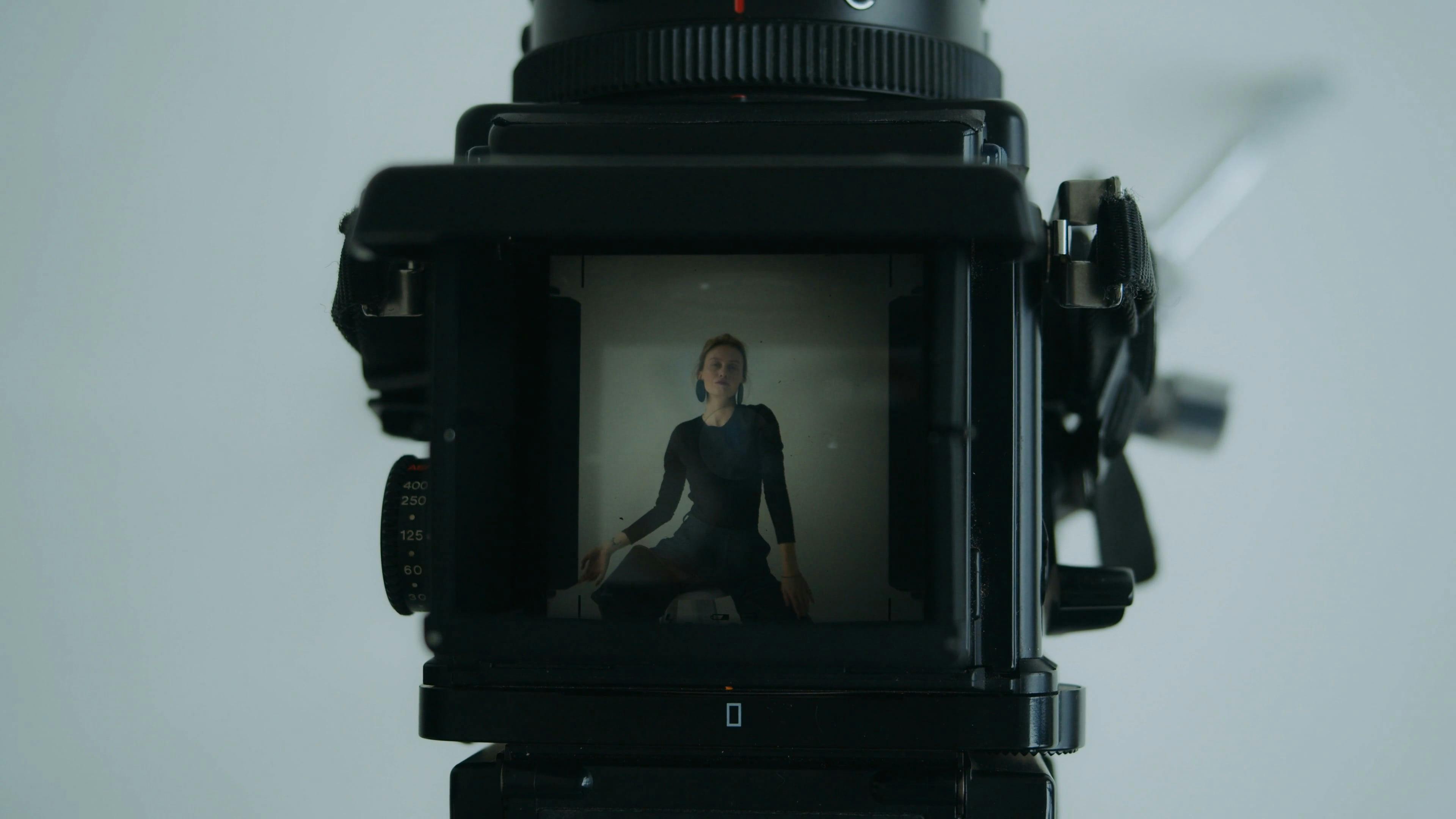 A Female Model Seen Posing on a Digital Camera · Free Stock Video