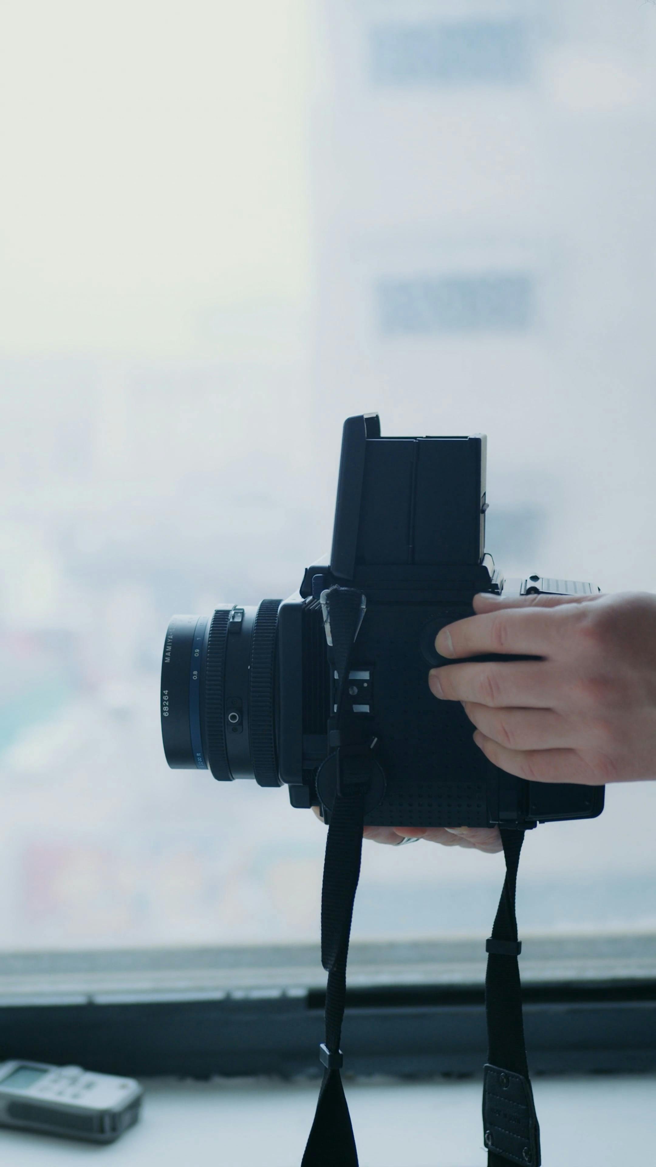 Photographer Adjusting the Camera Settings Free Stock Video Footage ...