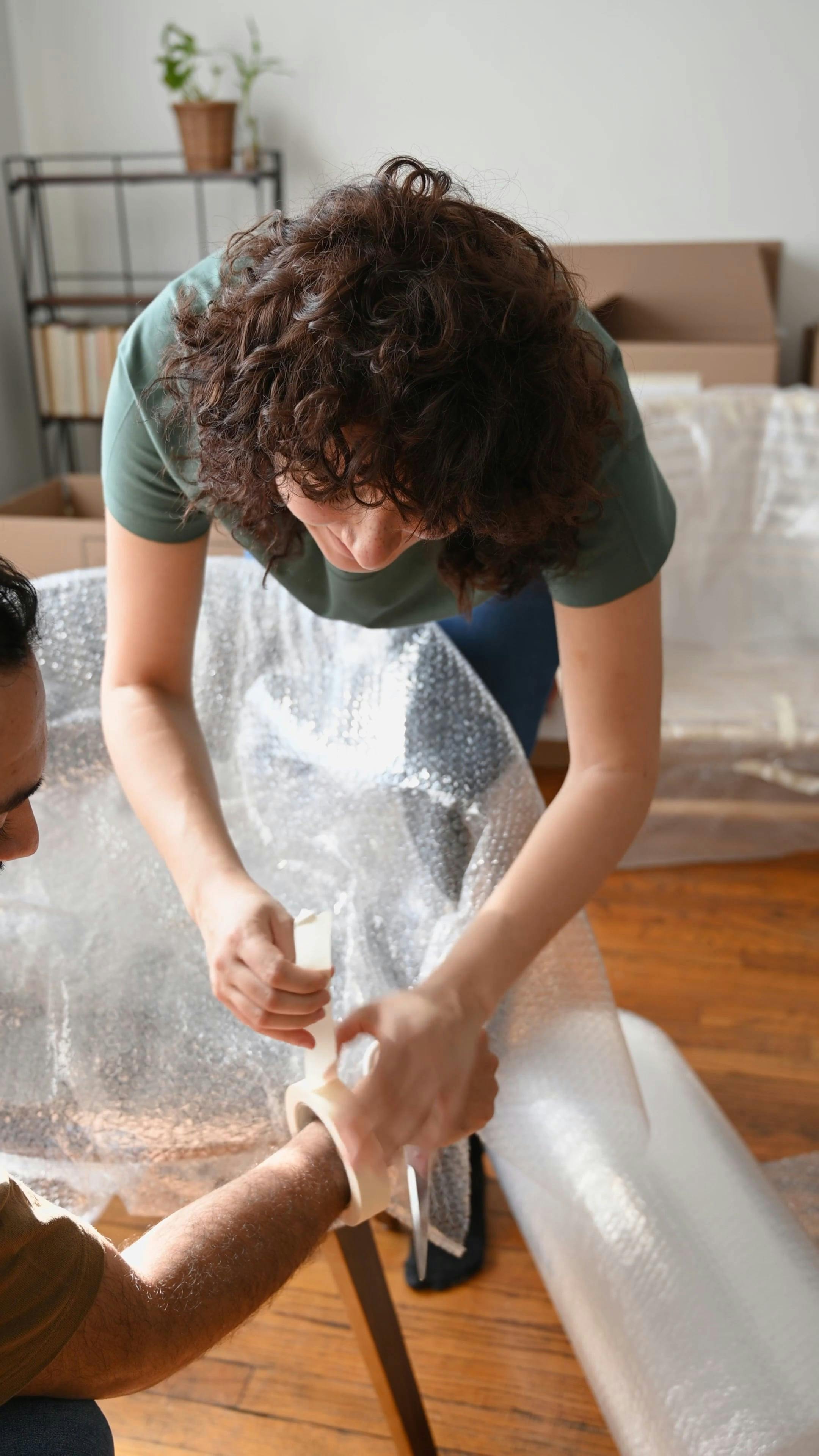 Woman Wrapping a Chair with Bubble Wrap Free Stock Video Footage ...