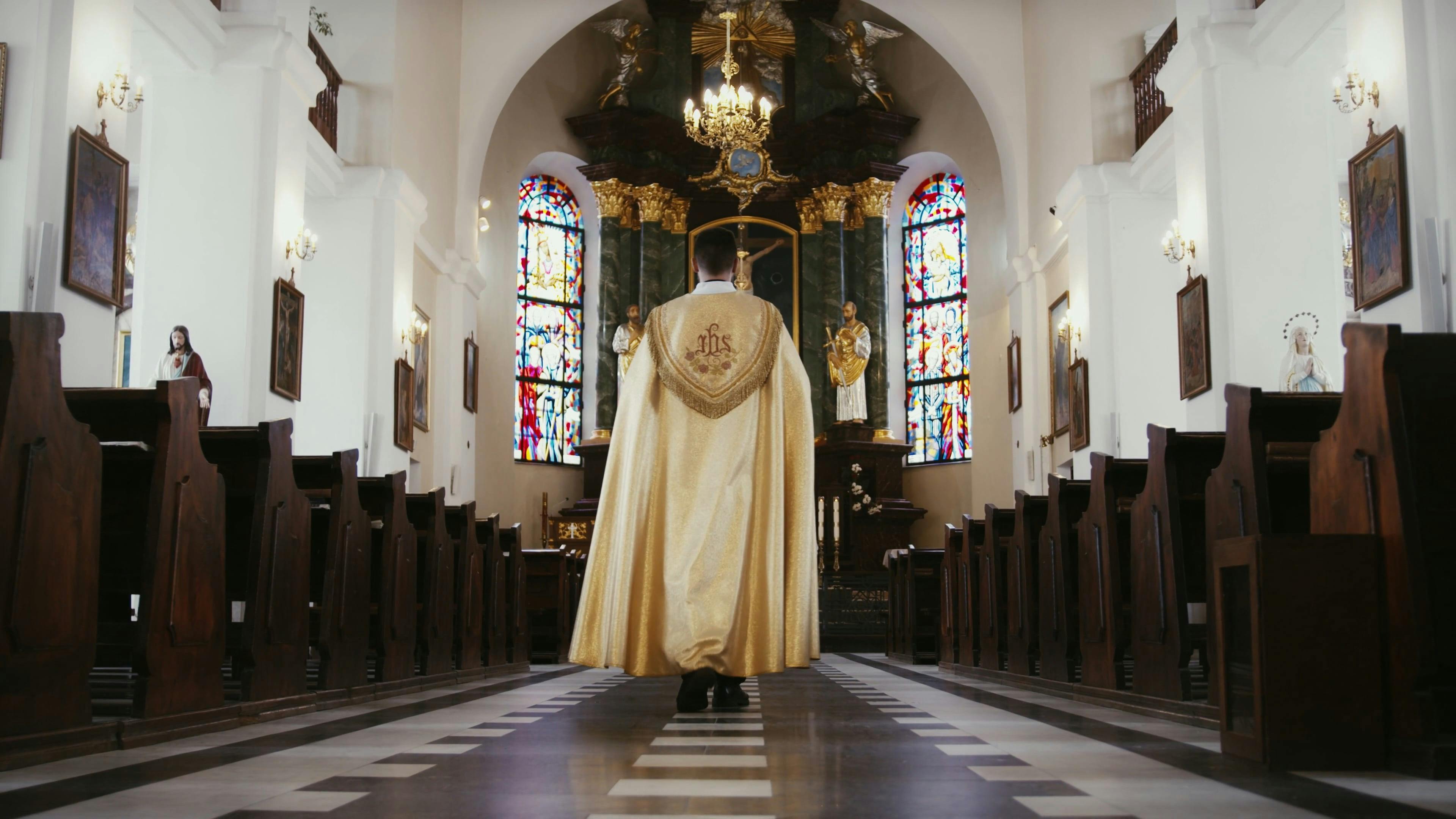 A Priest Walking Down an Aisle · Free Stock Video