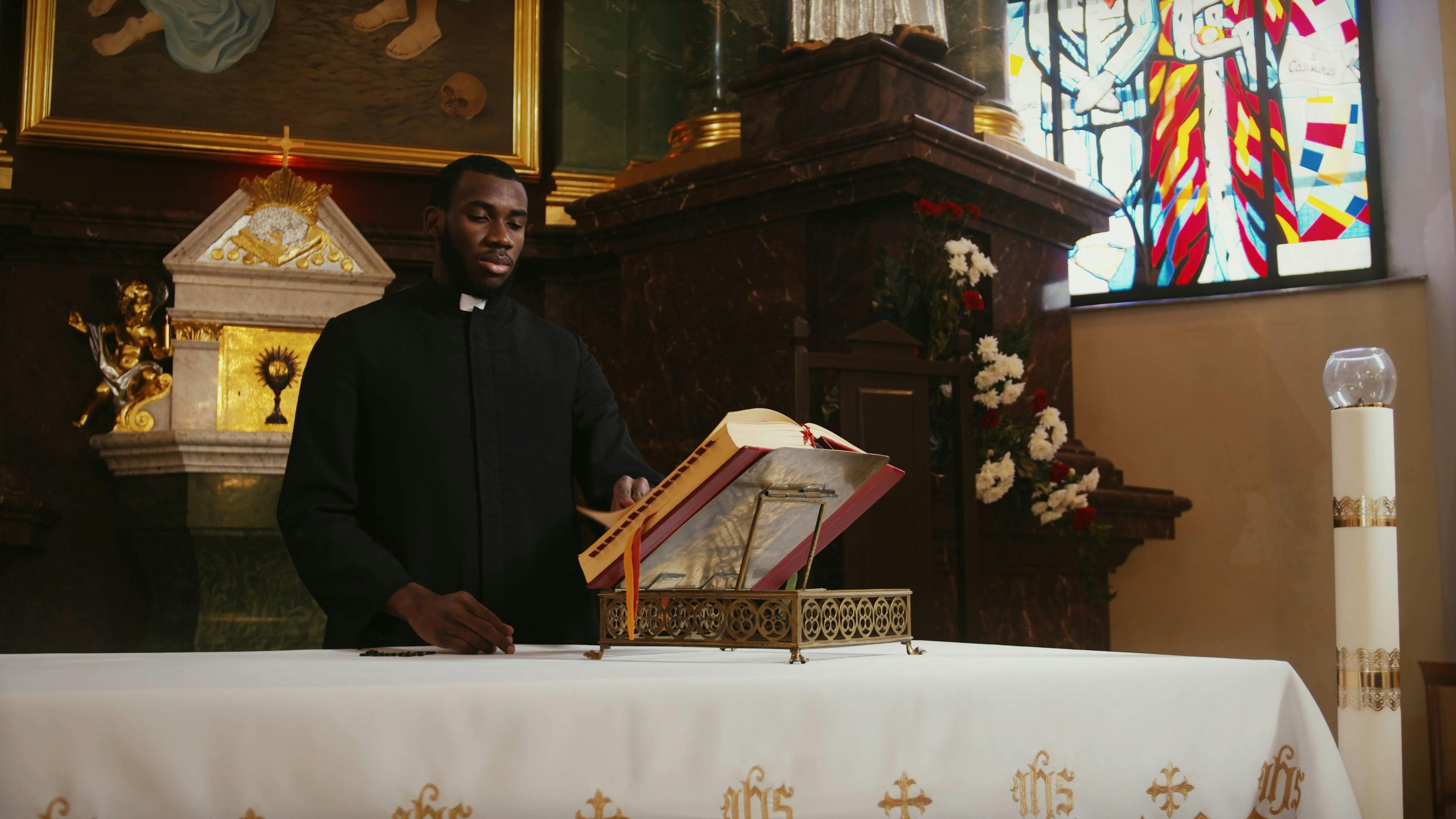 Catholic Father Reading the Bible in the Altar · Free Stock Video