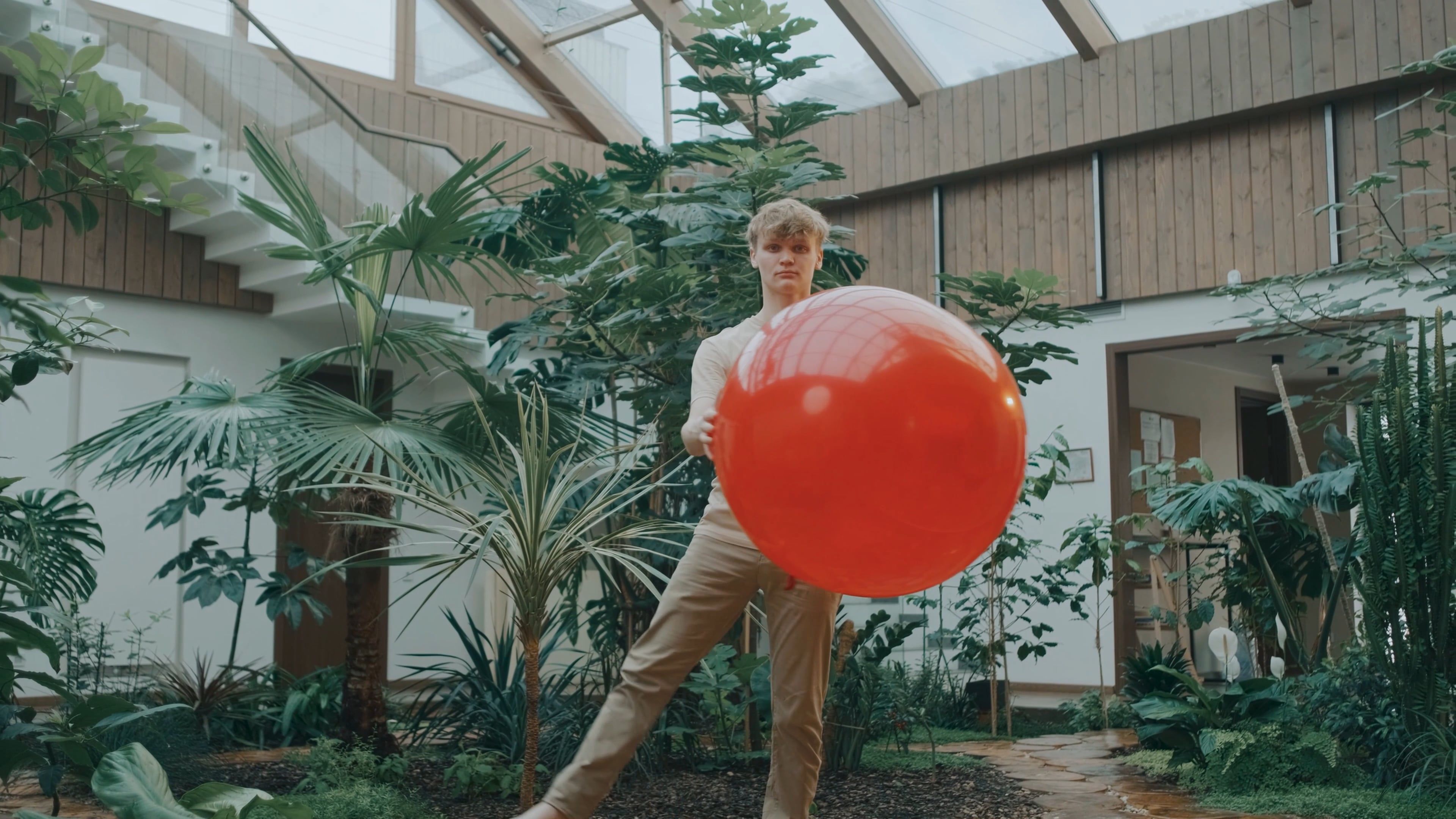 Man Holding a Big Red Ball · Free Stock Video