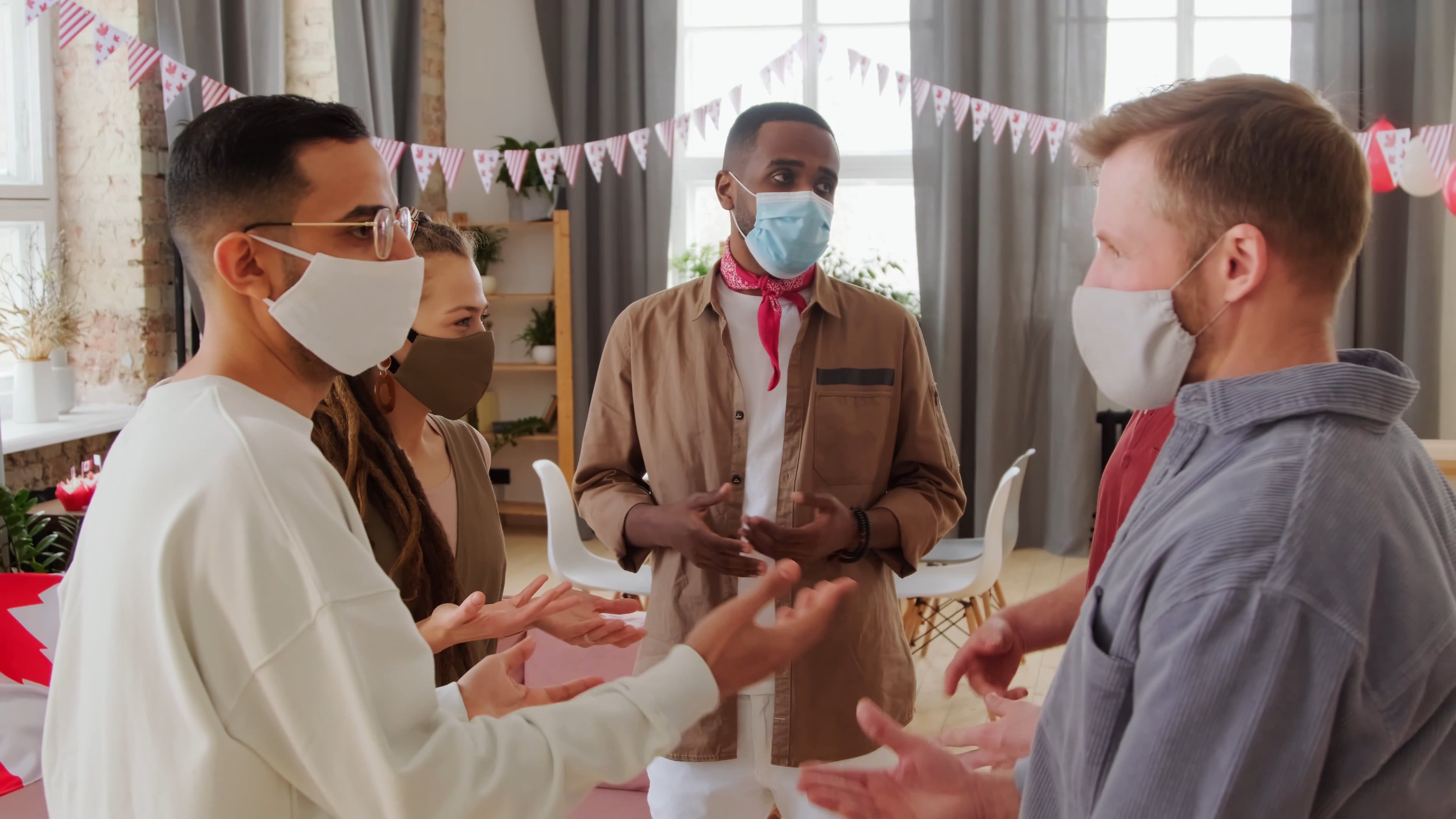 A Man Wearing a Face Mask Talking to Another Person · Free Stock Video