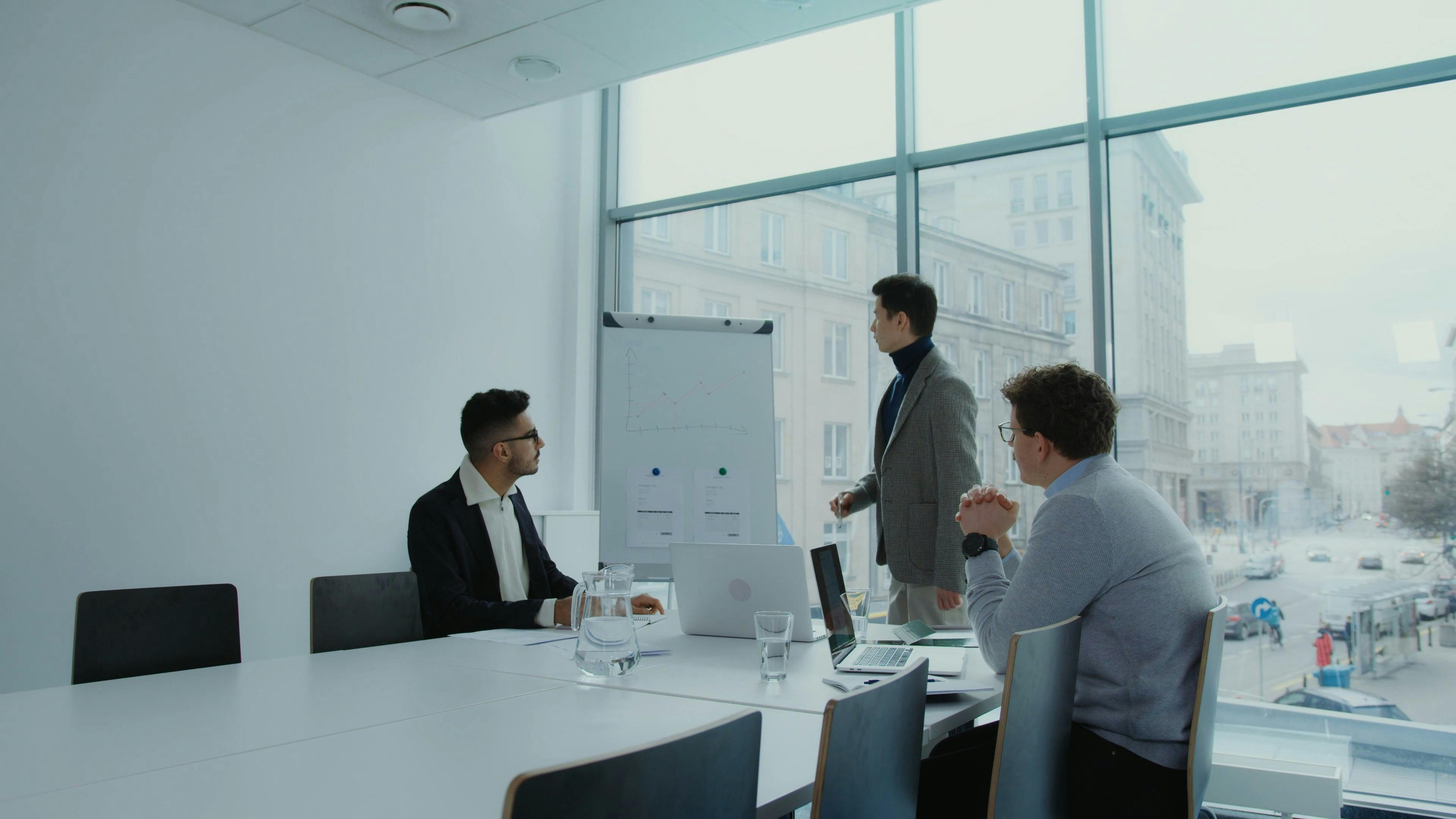 A Man Discussing to Colleagues at a Meeting · Free Stock Video