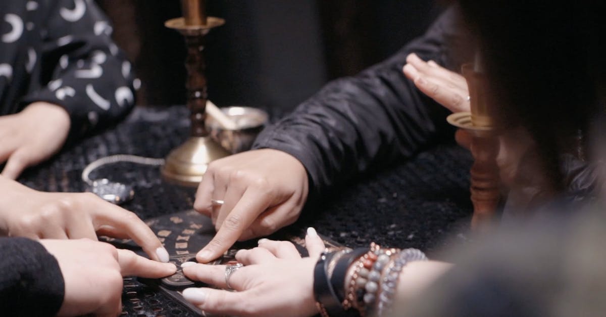 People Using An Ouija Board · Free Stock Video