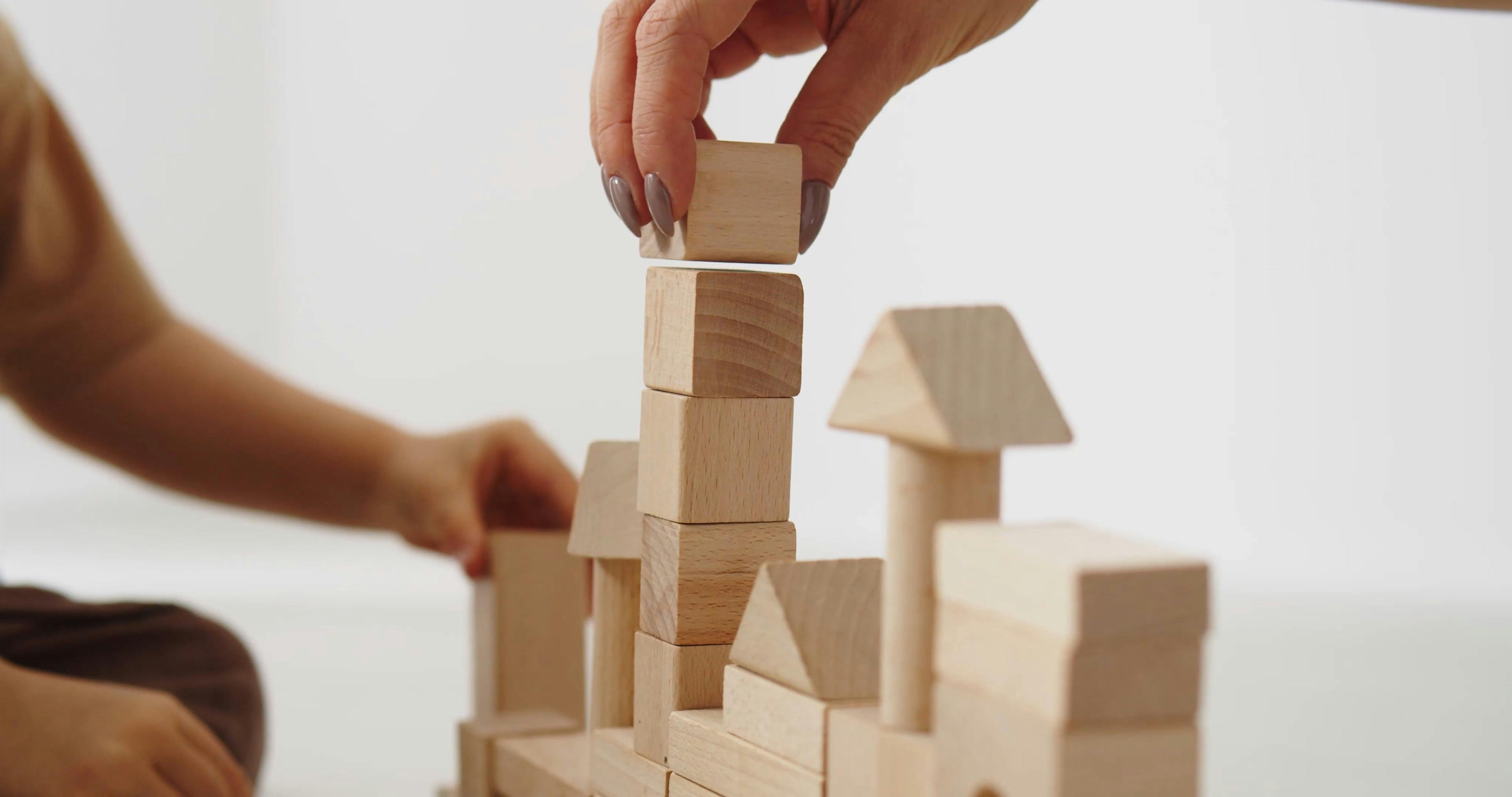 A Woman and a Child Playing with Building Blocks · Free Stock Video
