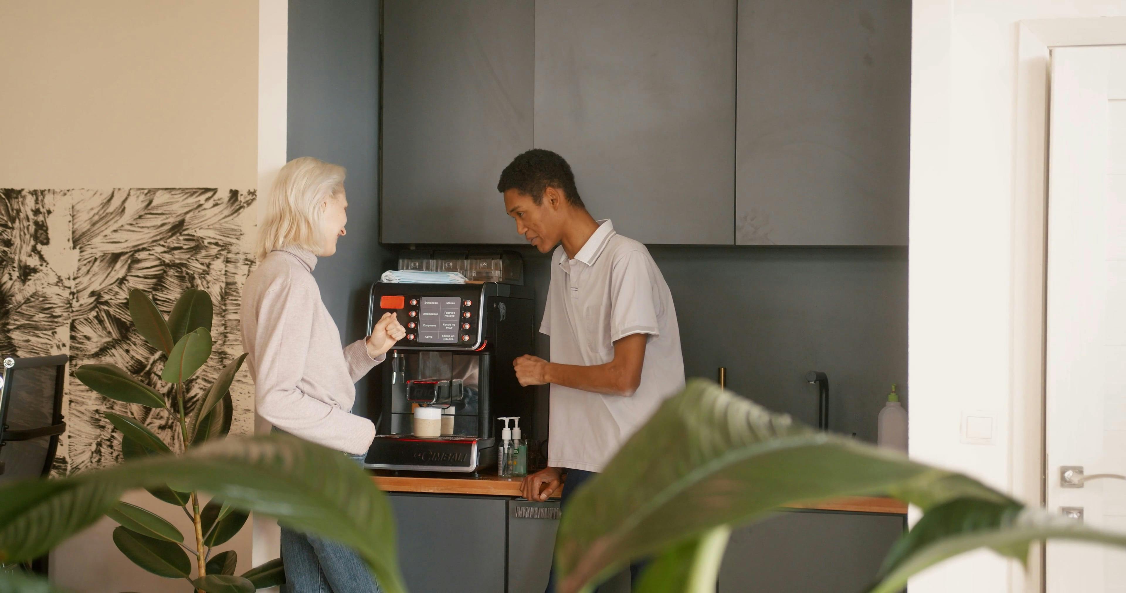 Workmates Talking In The Coffee Area · Free Stock Video