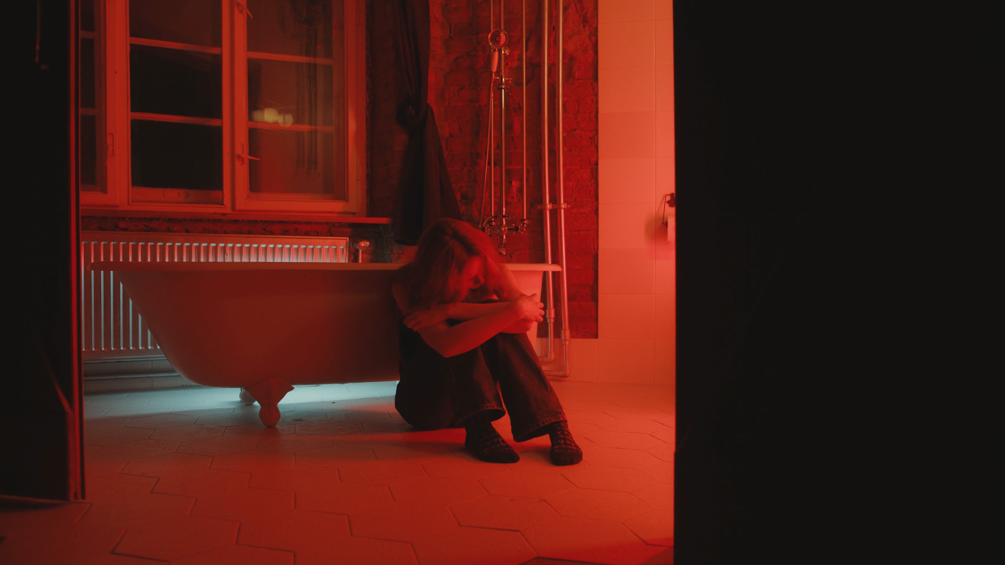 Depressed Woman Sitting on the Bathroom Floor · Free Stock Video