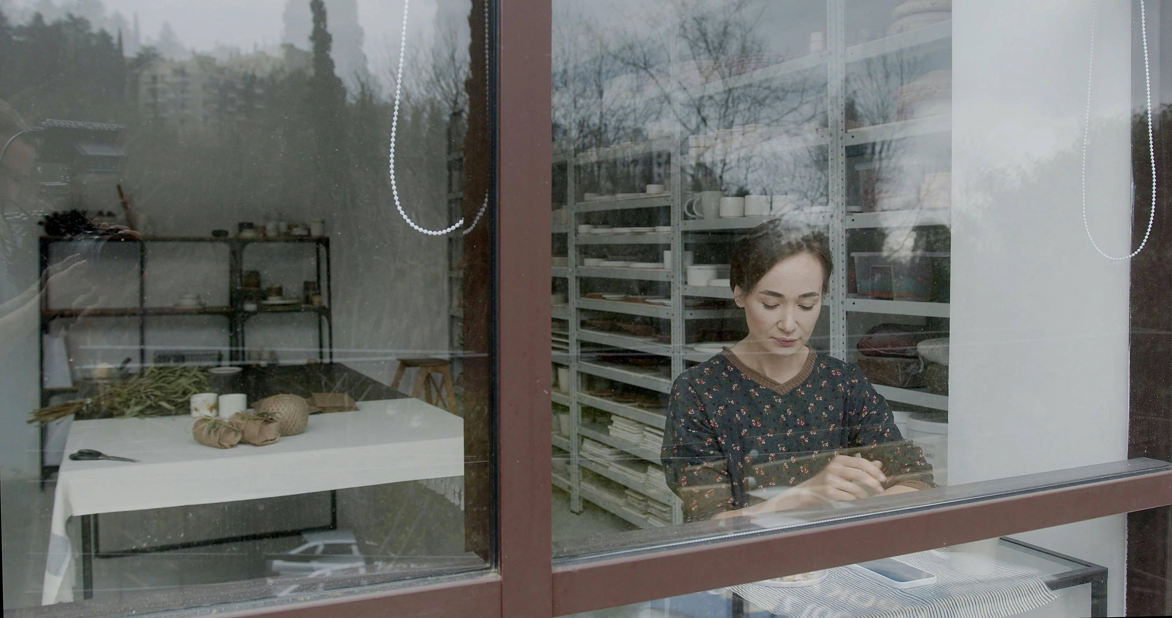 A Woman Eating by the Window · Free Stock Video