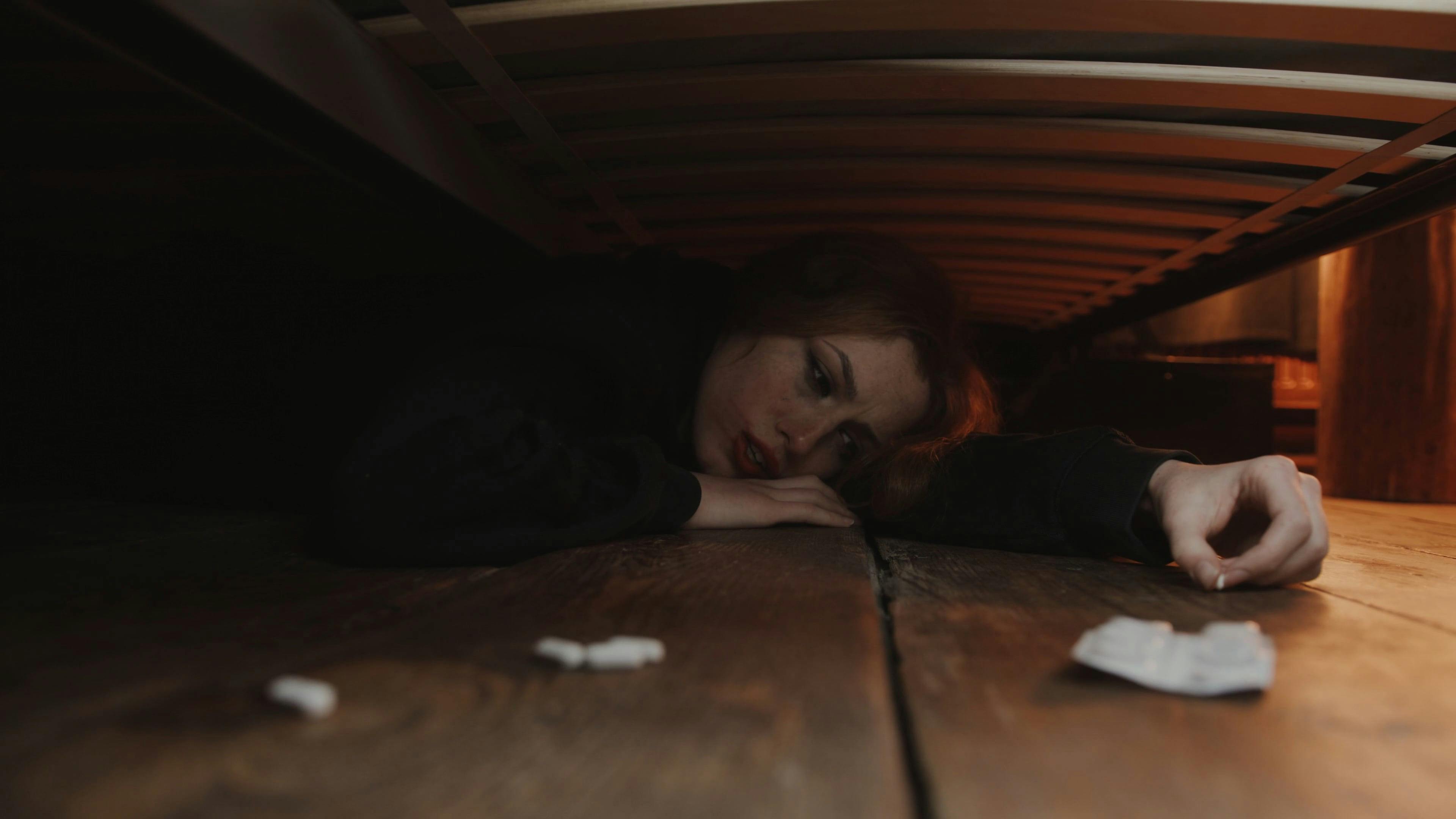 A Woman Crying on the Ground While Picking up Pills Free Stock Video ...