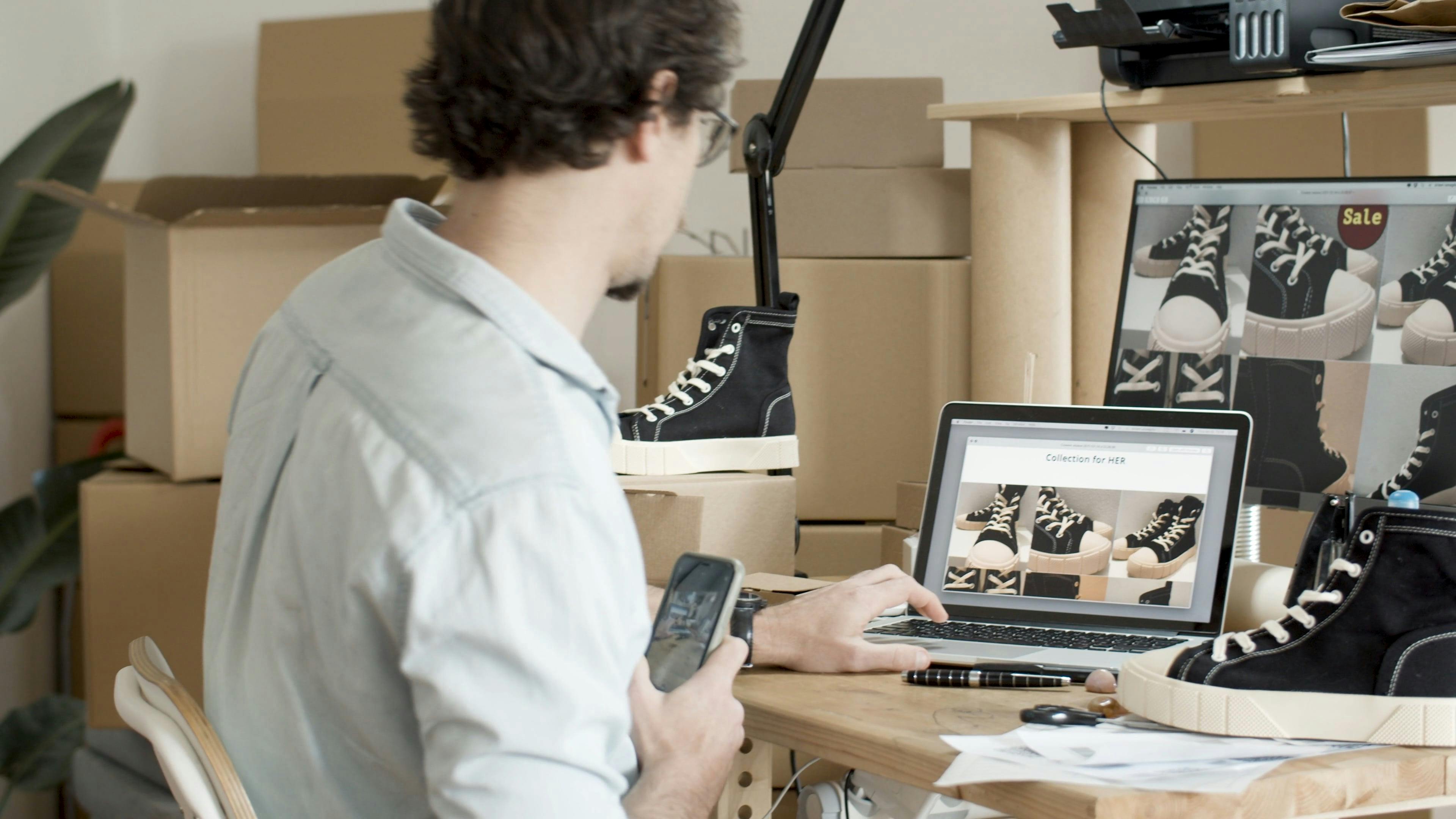 Man Checking Shoes Photos on His Laptop Free Stock Video Footage ...