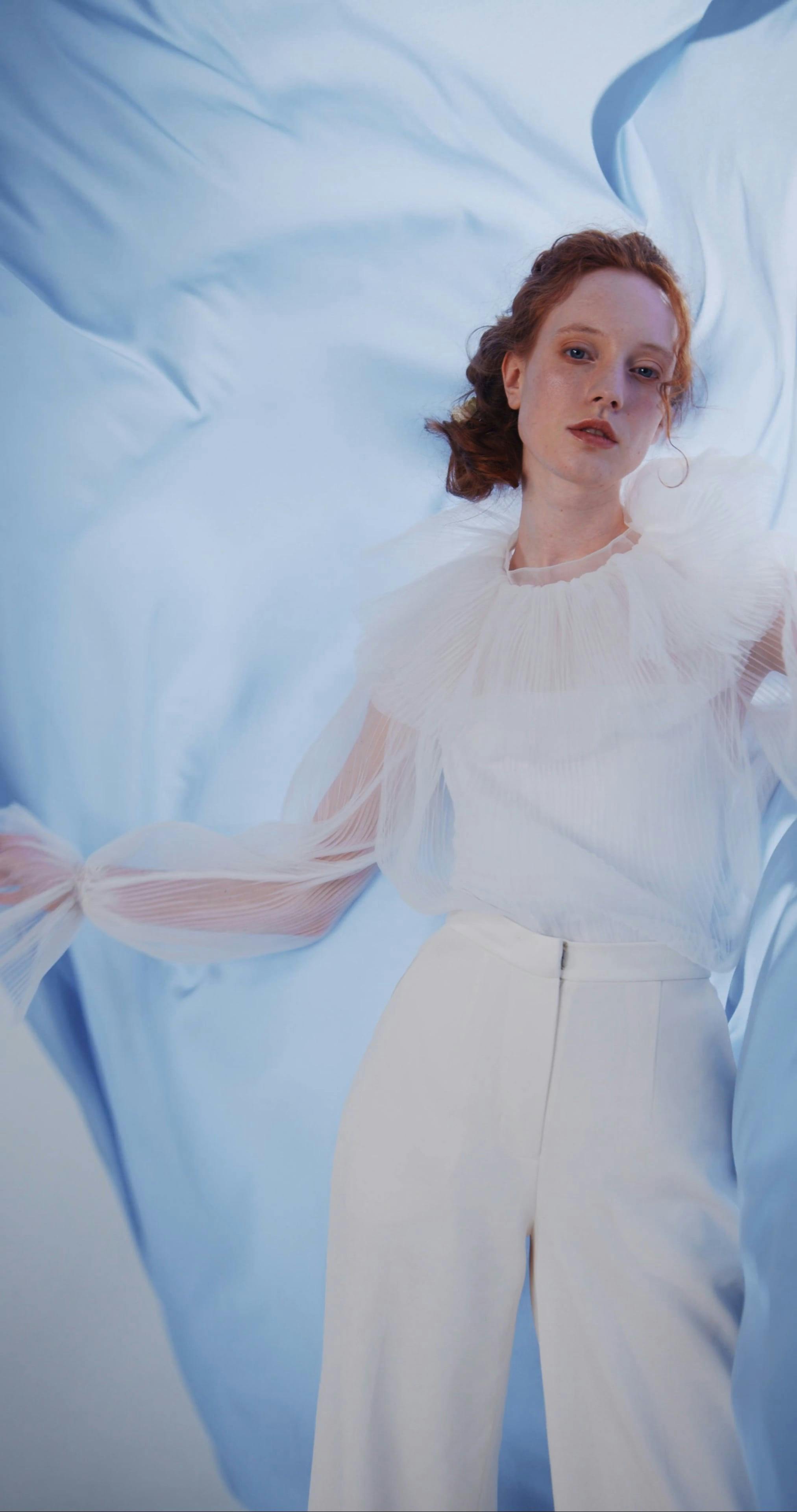 Woman Modeling in White Outfit · Free Stock Video