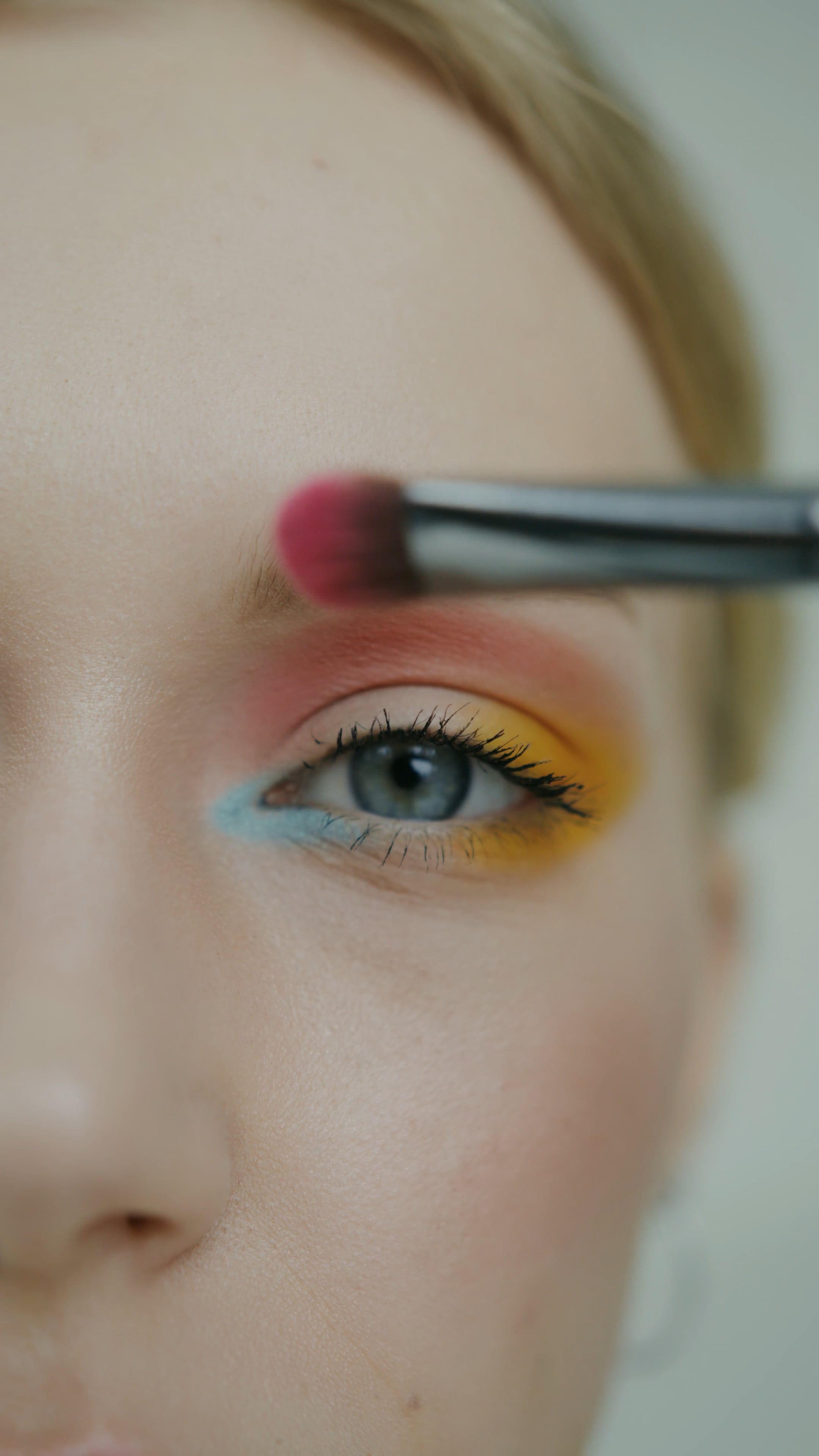Woman Applying Colorful Eyeshadow · Free Stock Video