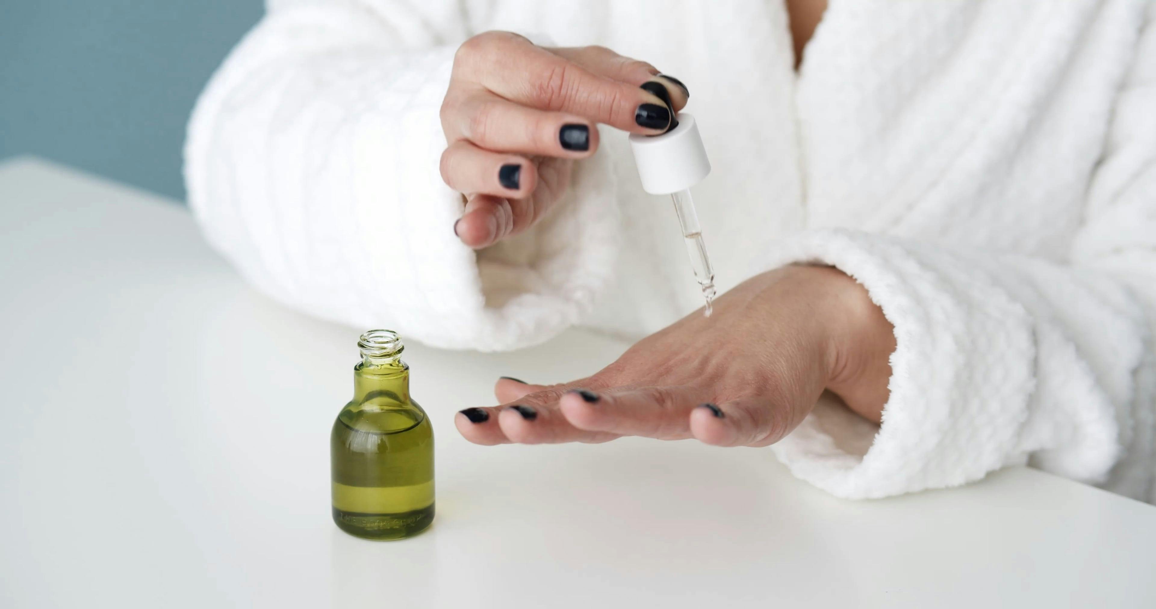 A Person Applying Serum on Hands · Free Stock Video