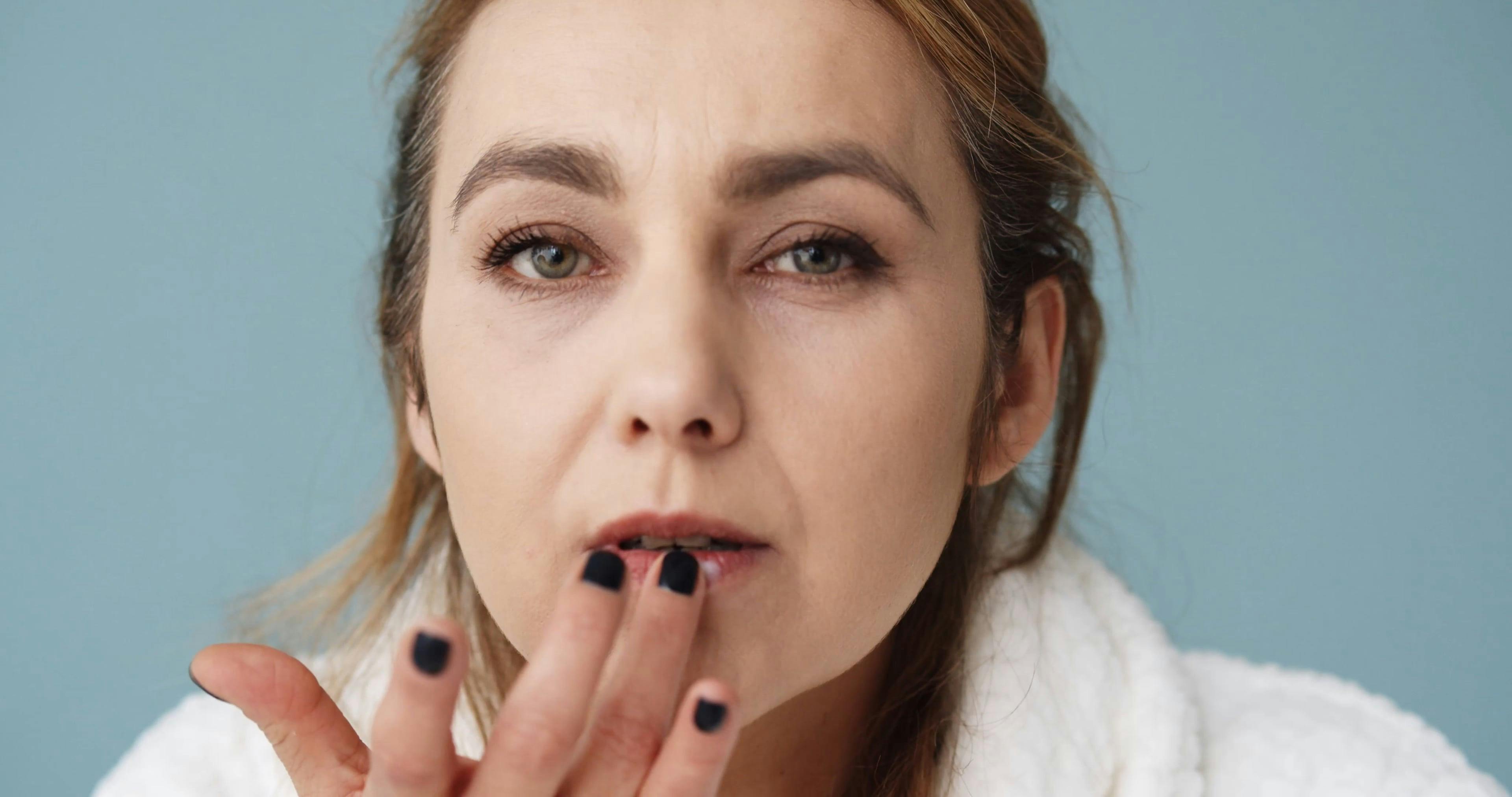 Woman Applying Cream on her Lips Free Stock Video Footage, Royalty-Free ...