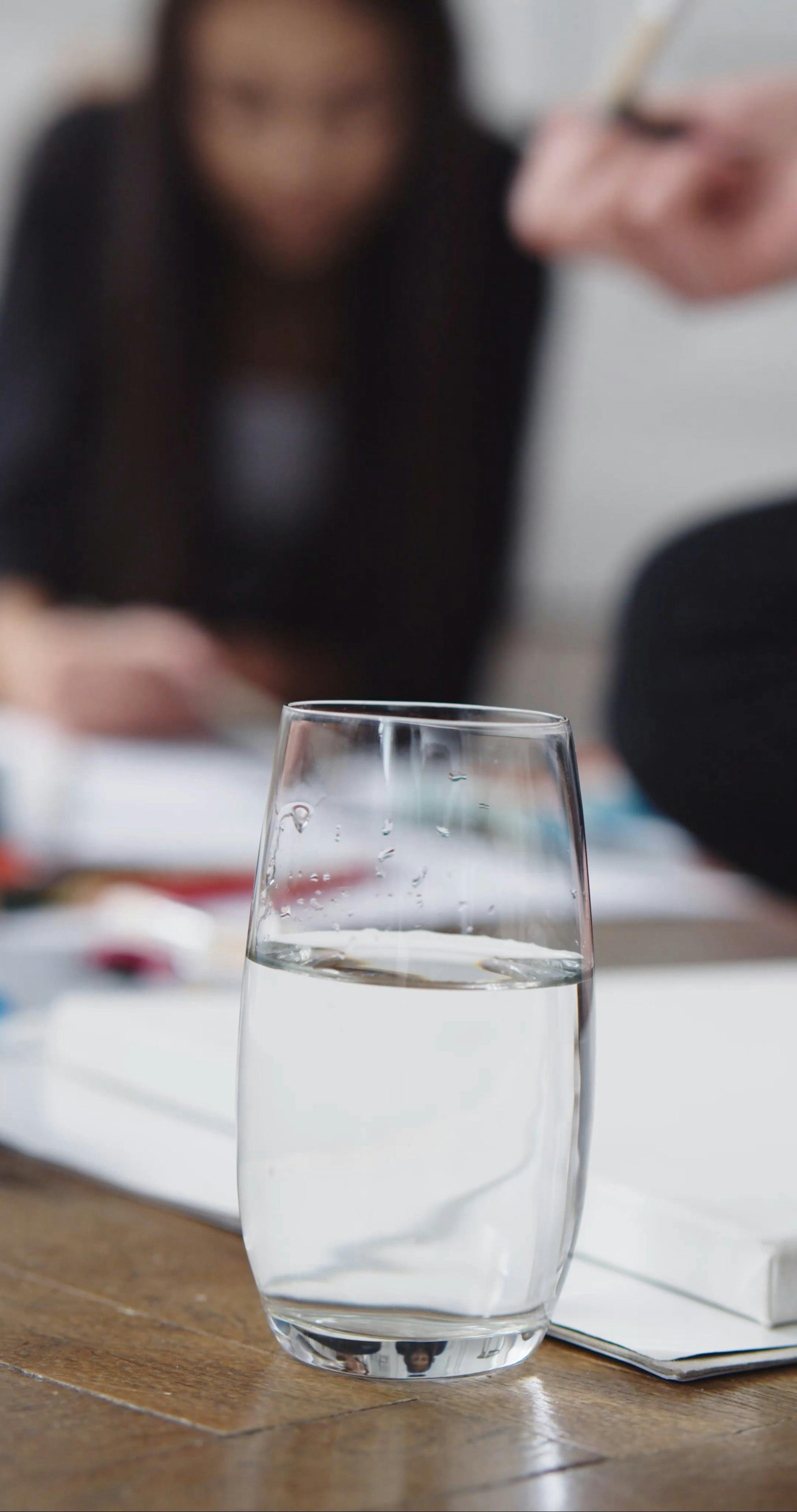 Person Dropping a Tablet on a Glass of Water · Free Stock Video