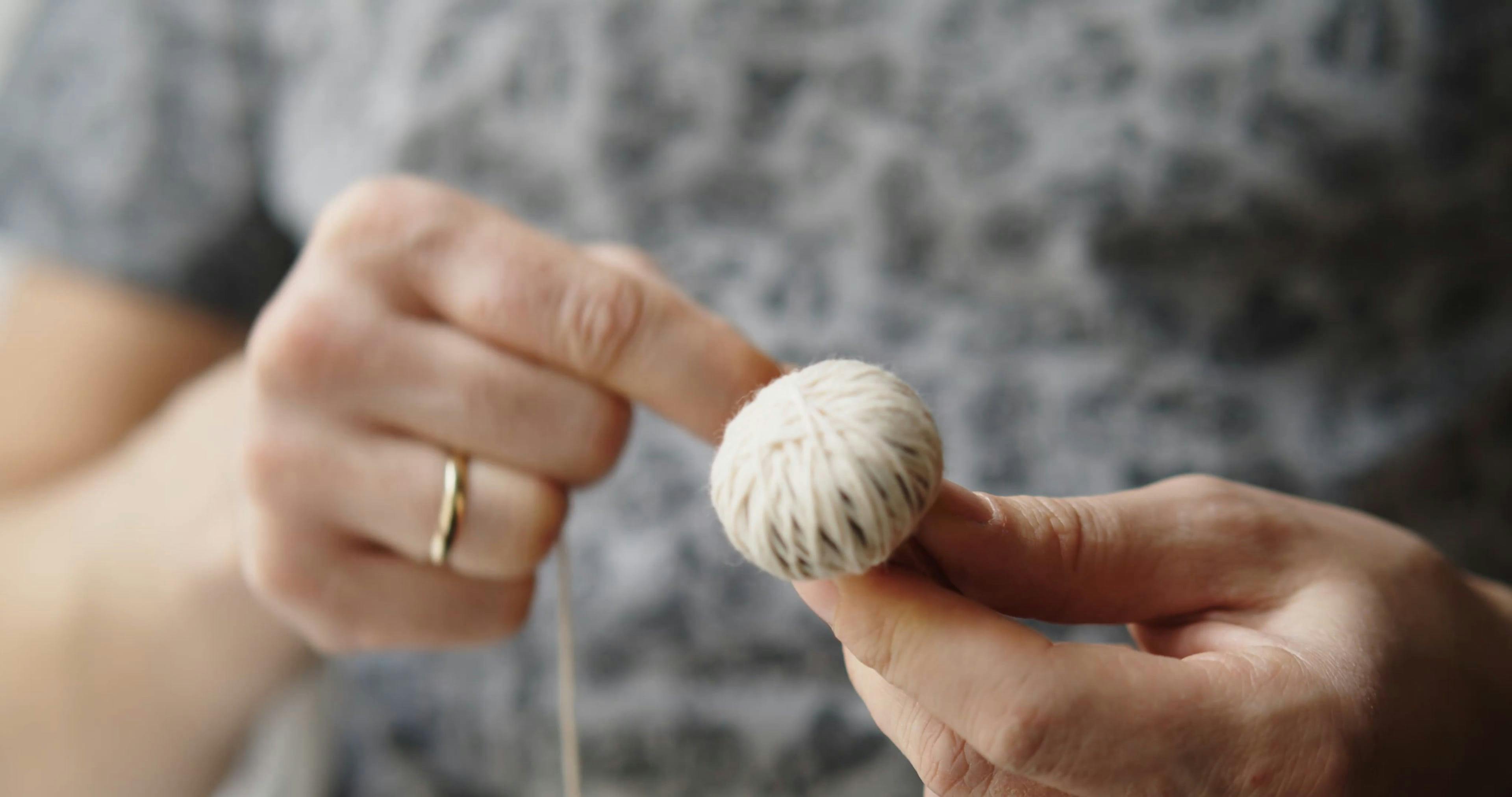 Person Rotating the Cotton Thread on Circular Pattern · Free Stock Video