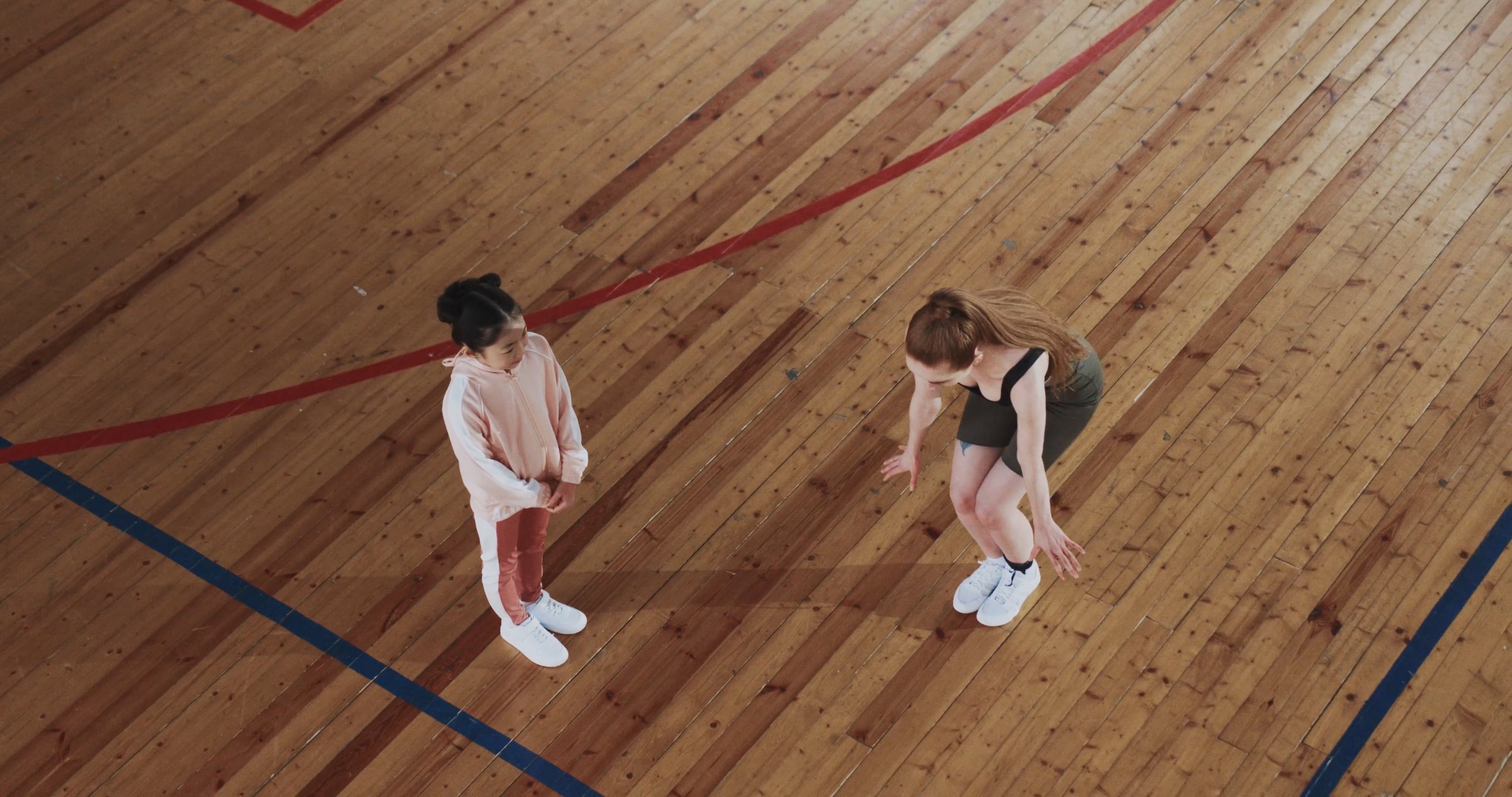 Woman Teaching a Girl on How To Cheer Dance · Free Stock Video