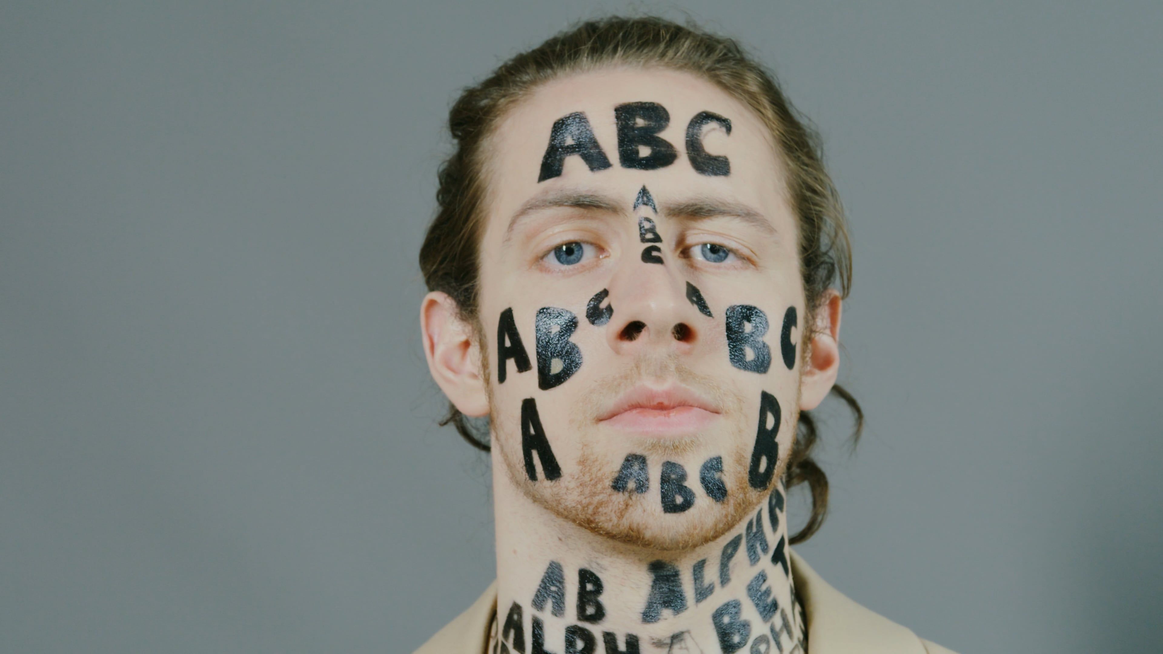 Close up of a Man with Letters on his Face and Neck Free Stock Video ...