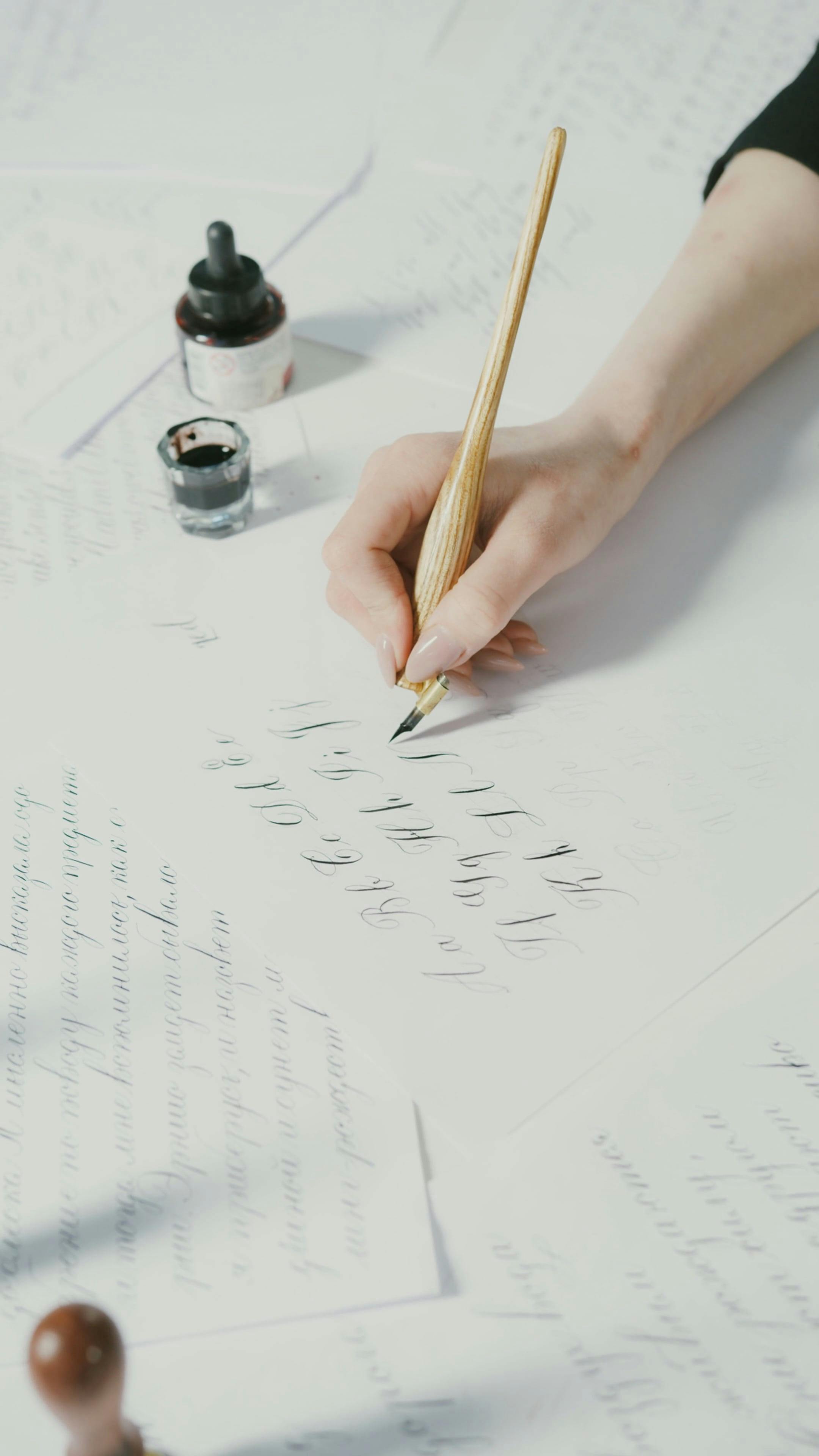 Person Writing using Pen and Ink · Free Stock Video