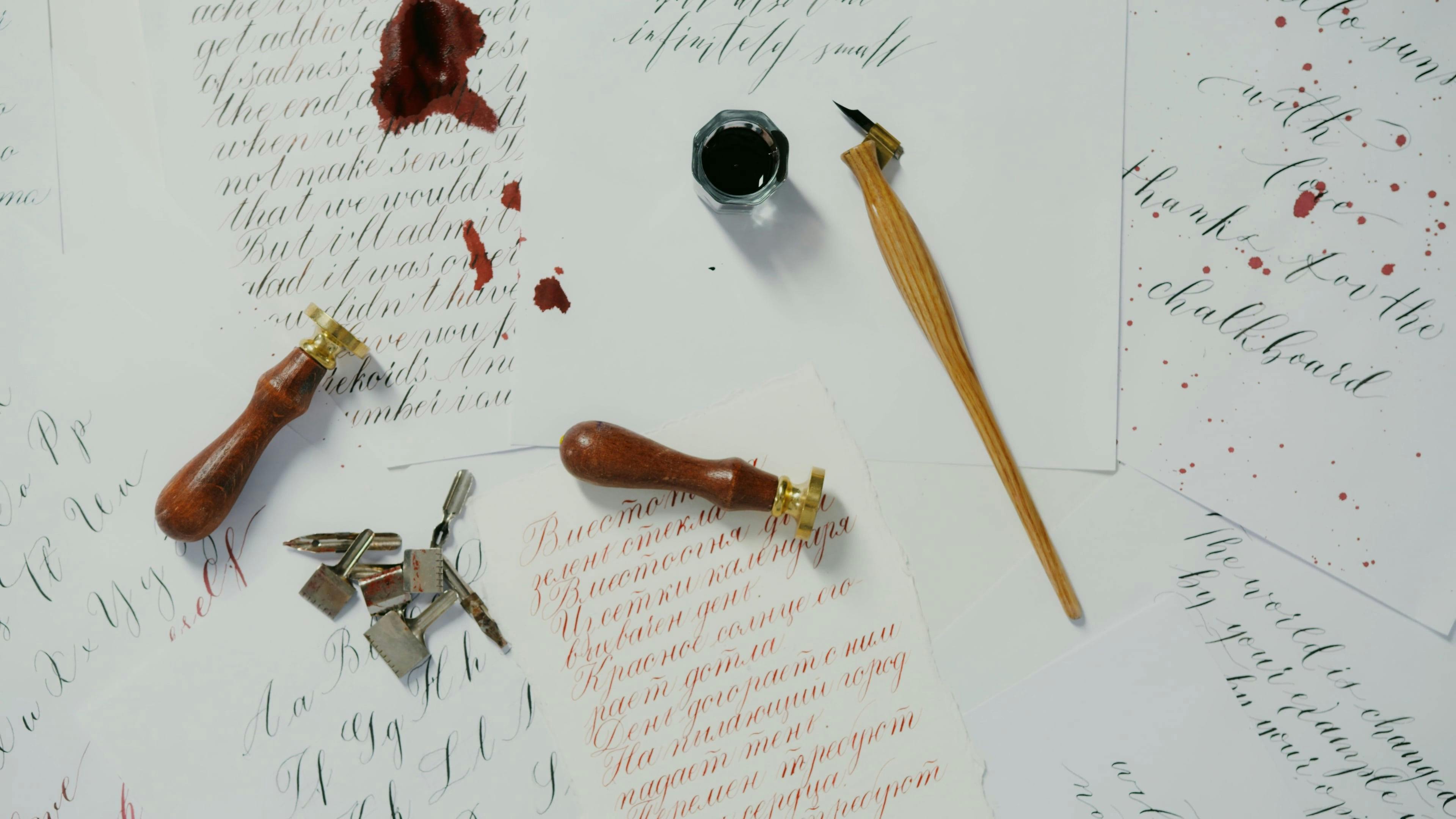 Overhead Shot of a Dip Pen and Seals on Ink Stained Papers · Free Stock ...