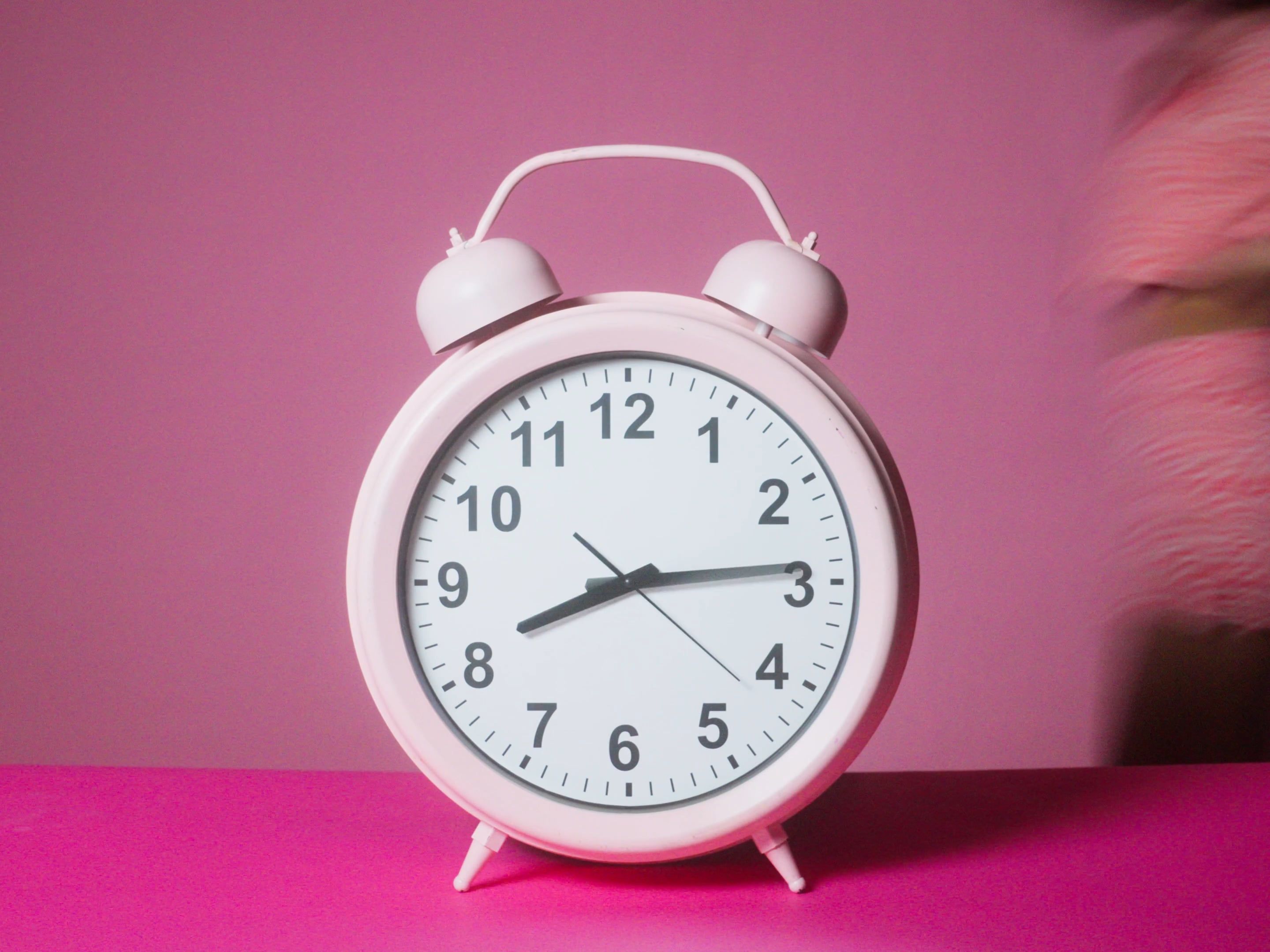 A Bored Girl Waiting With A Big Alarm Clock Besides Her Free Stock ...