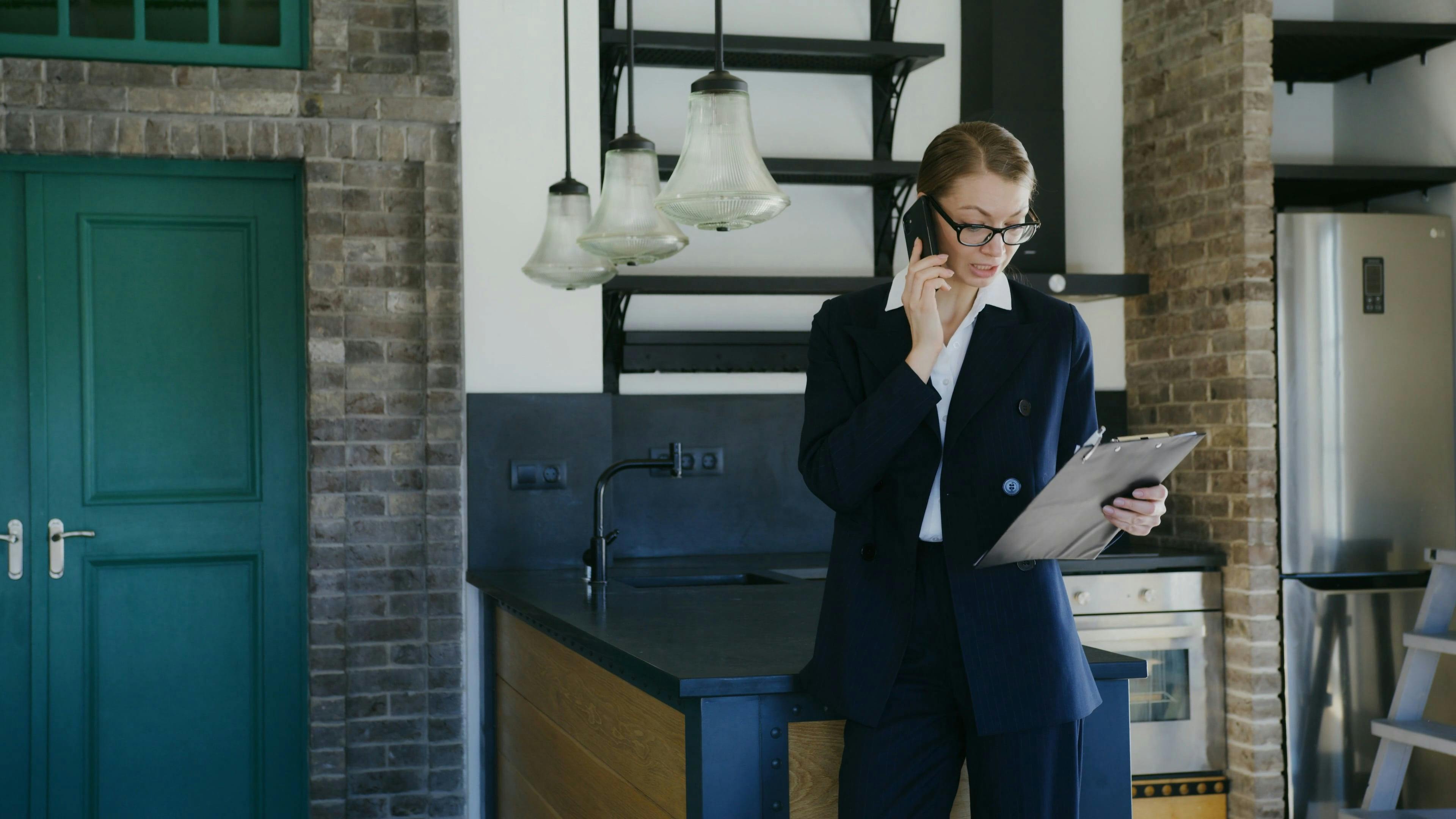 A Real Estate Agent Talking using Smartphone · Free Stock Video