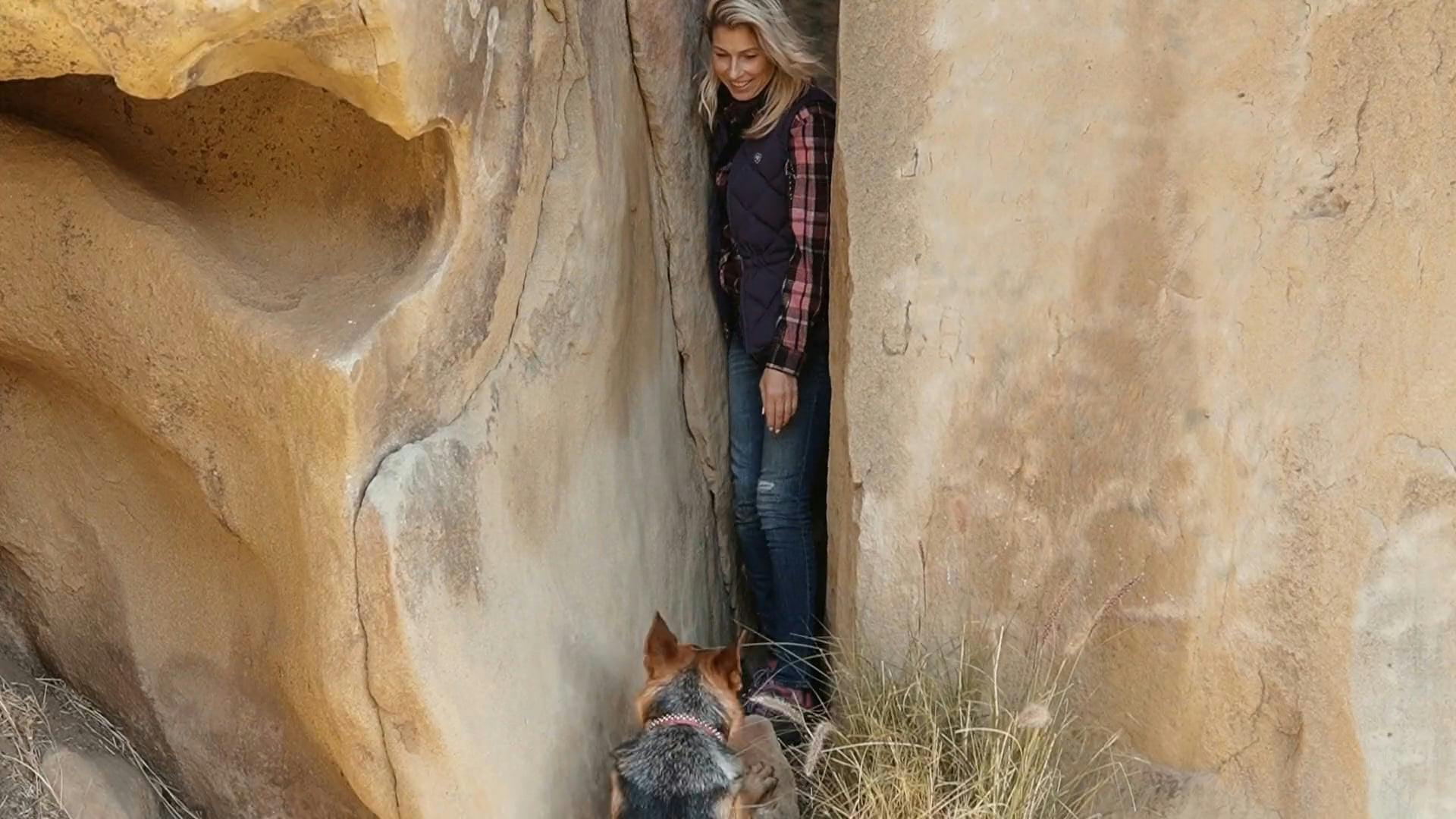 Woman in between Rocks · Free Stock Video