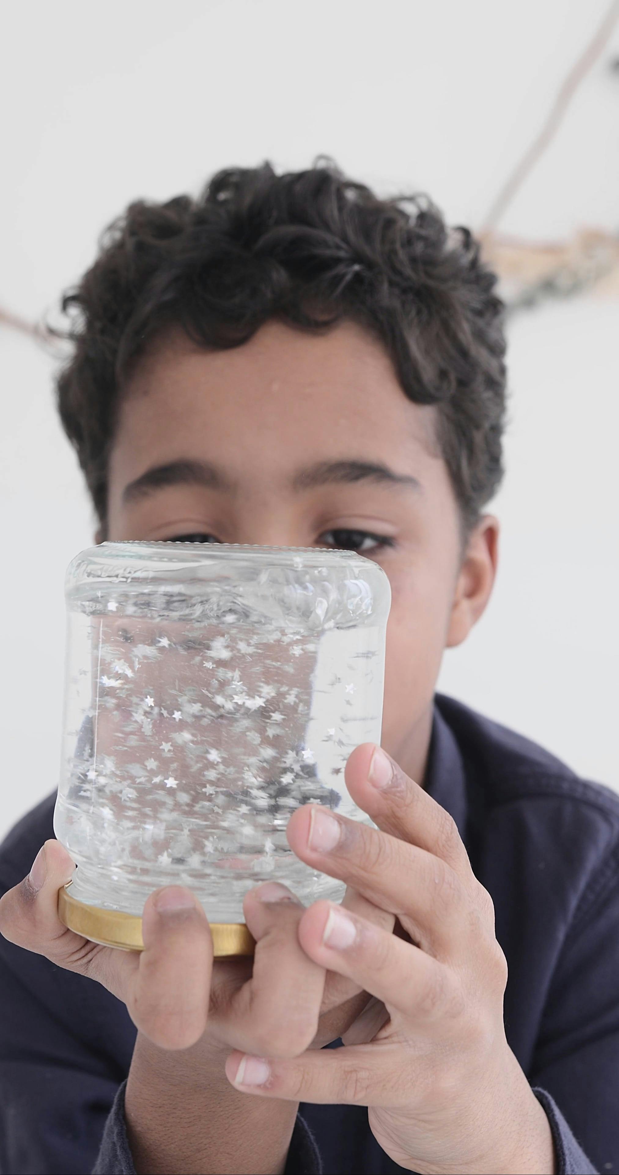 Boy Shaking a Jar Filled with Water Free Stock Video Footage, Royalty ...