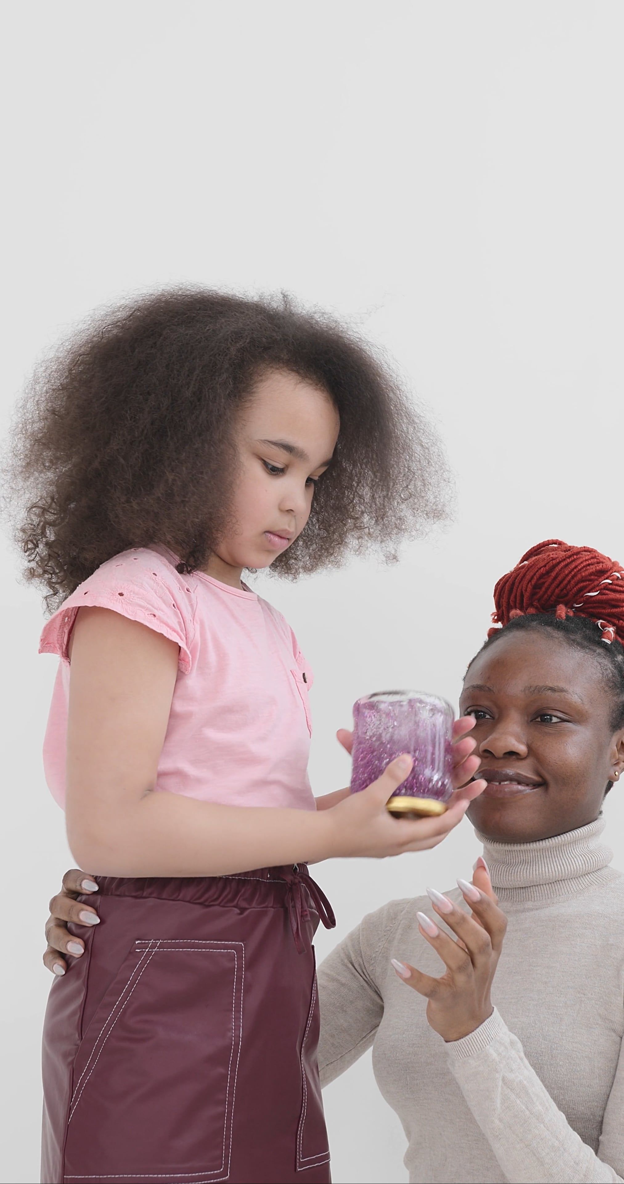 Girl Shaking a Jar of Water Full of Glitters Free Stock Video Footage ...