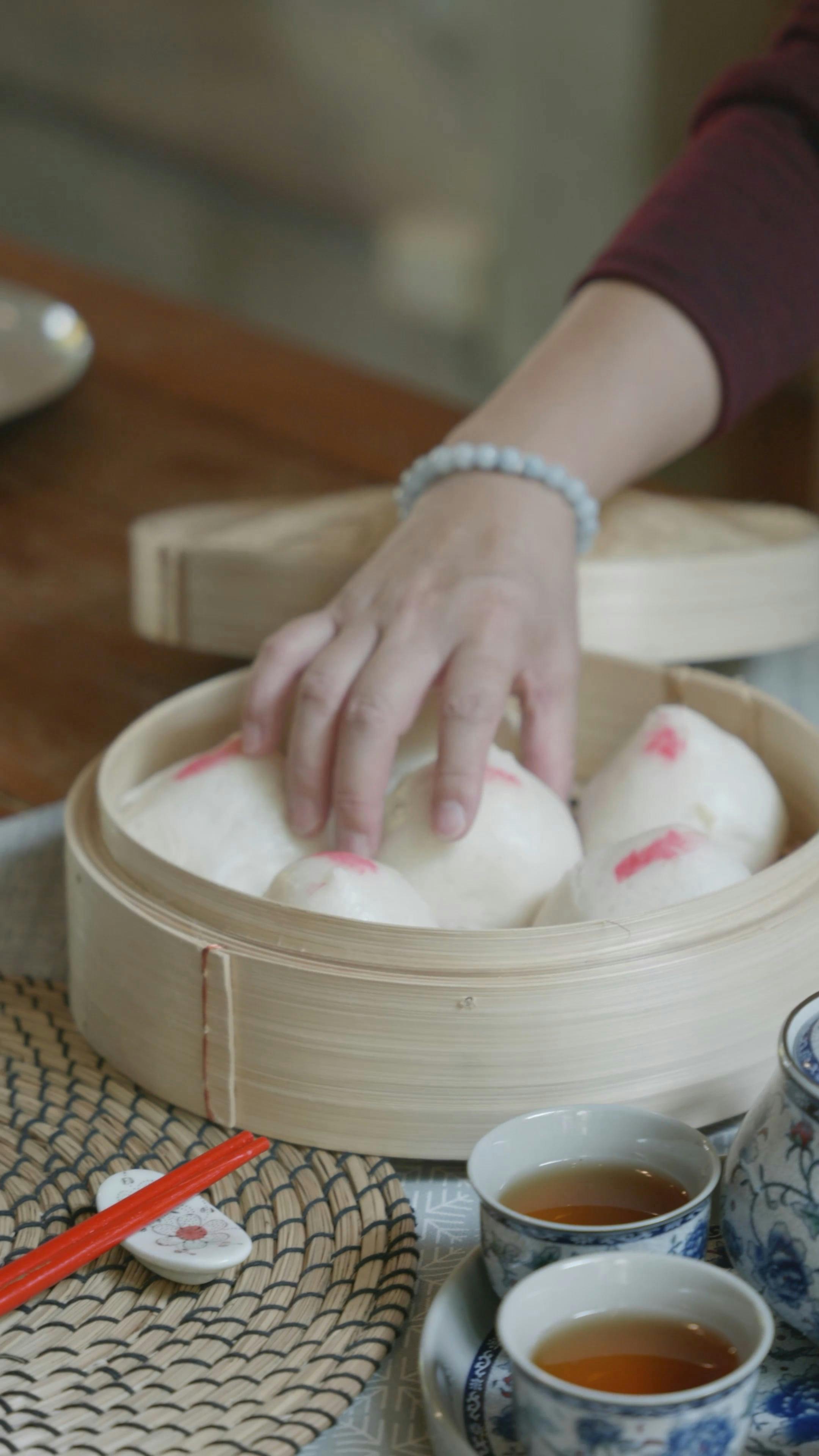 A Person Serving a Siopao · Free Stock Video