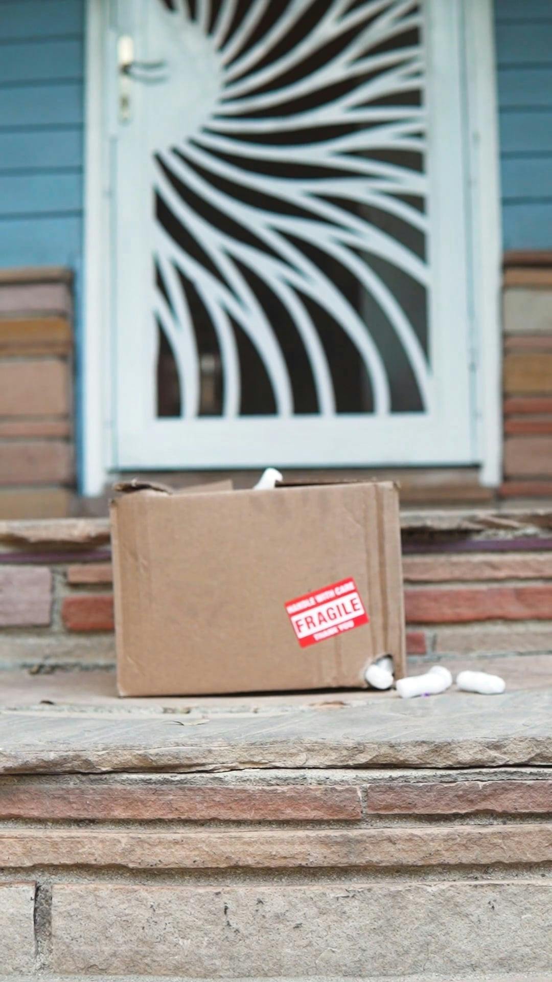 An Abandoned Box Outside the Doorstep · Free Stock Video