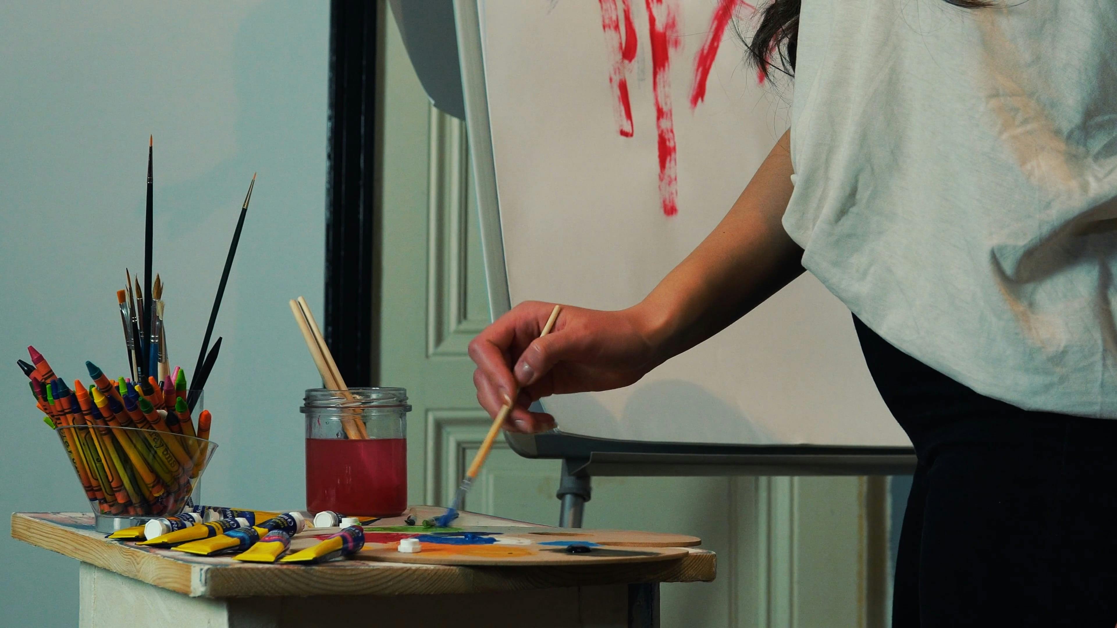 Someone Painting On Canvas