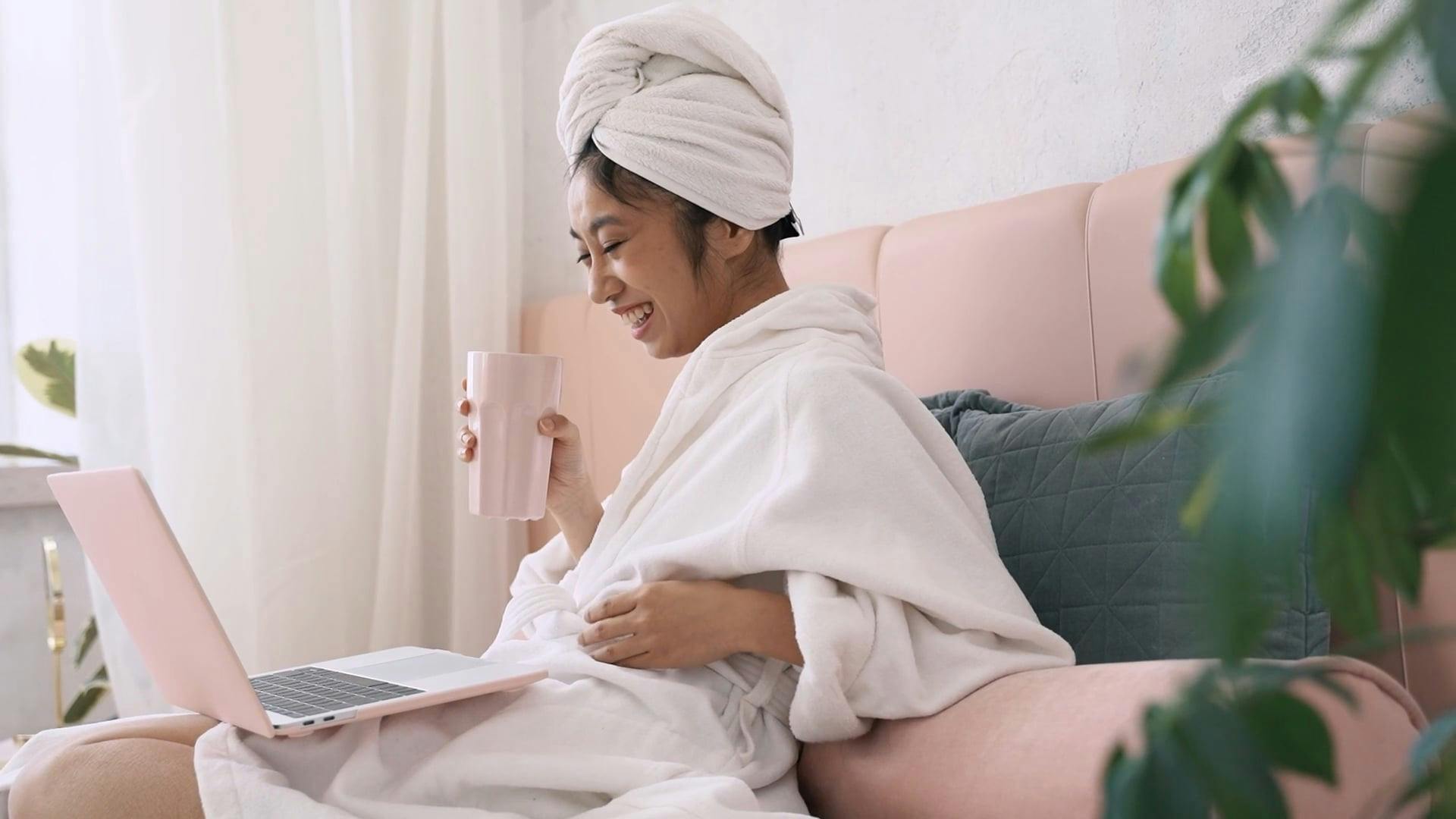A Woman Using A Laptop After Taking A Bath · Free Stock Video