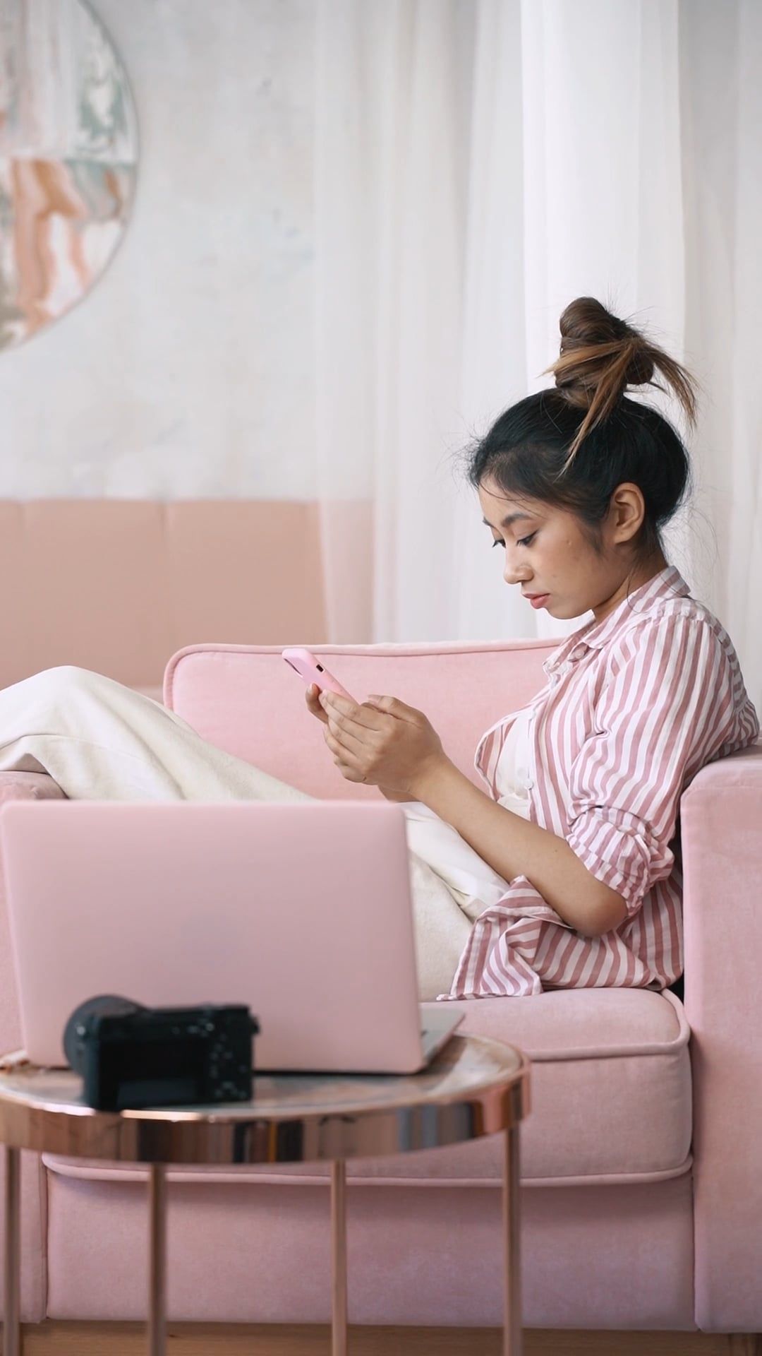 A Woman Using Her Phone while Sitting on a Couch · Free Stock Video