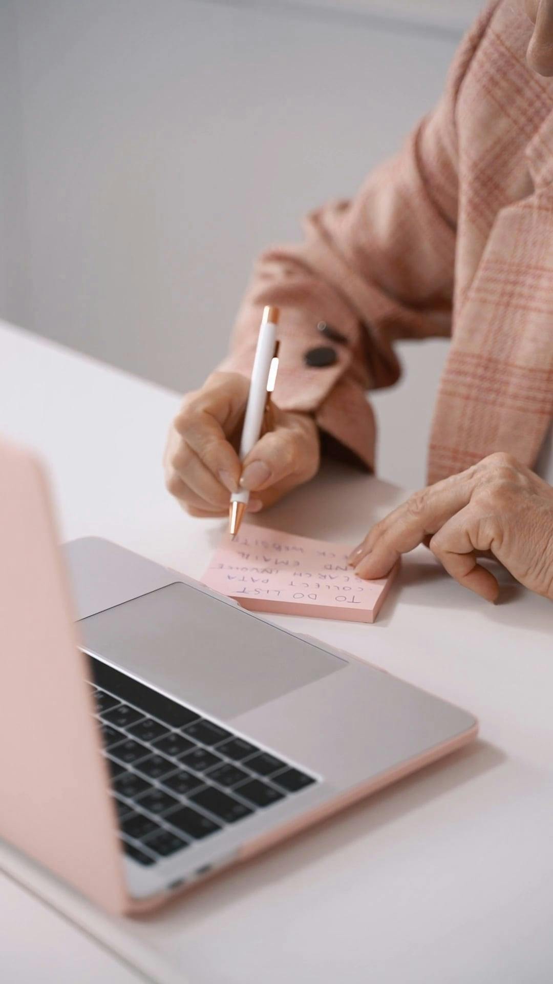 Person Taking Notes while Looking at the Laptop Free Stock Video ...